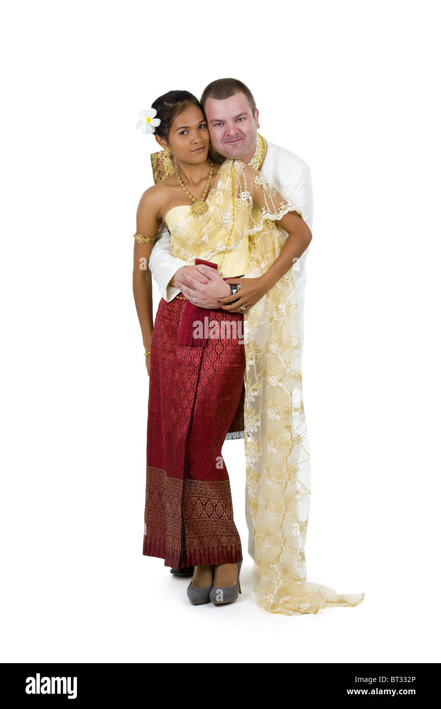 happily married couple in traditional thai wedding clothes posing on ...