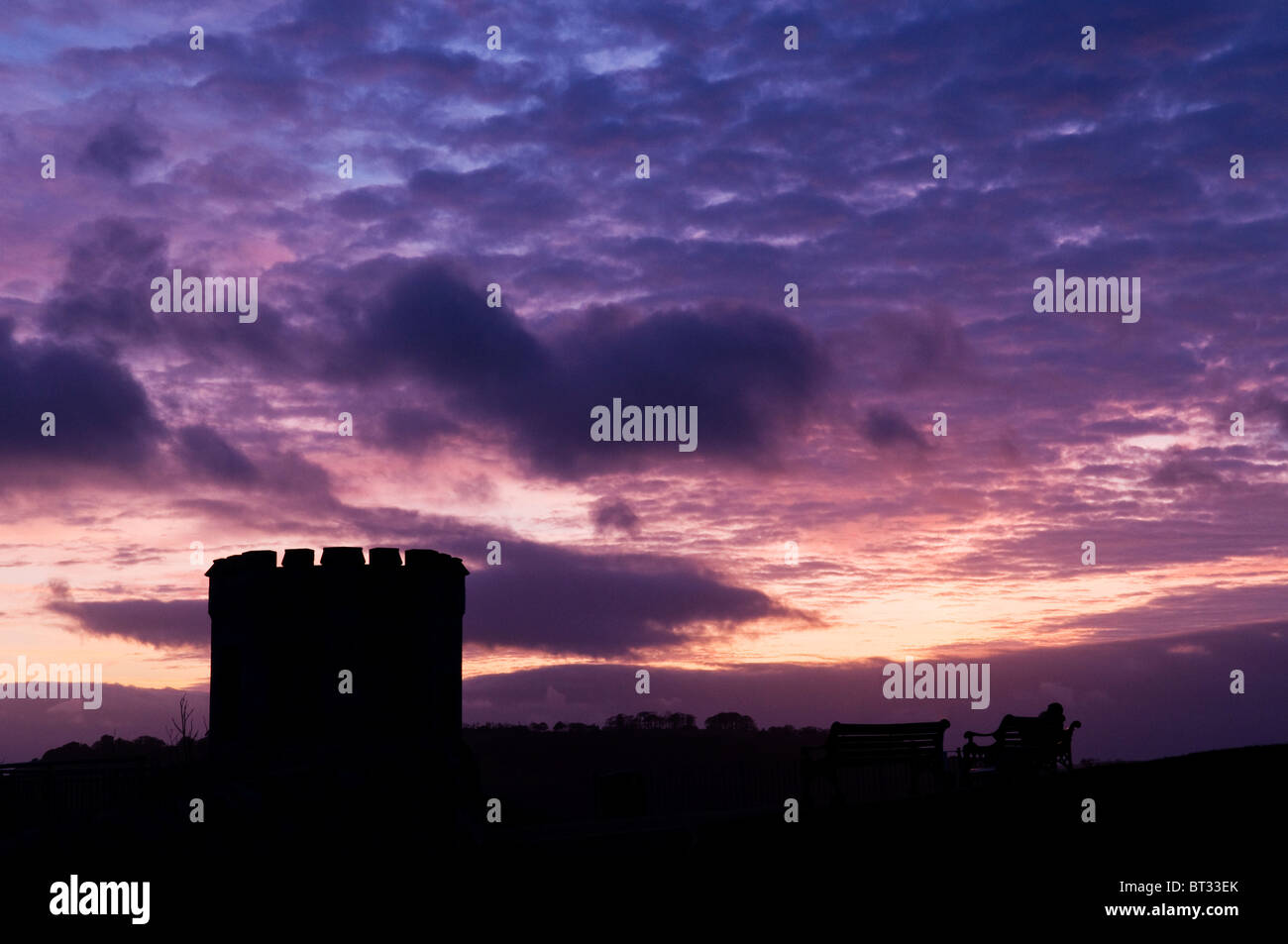 Silhouette of Victorian watchtower built on Plymouth Hoe, with dusk sky ...