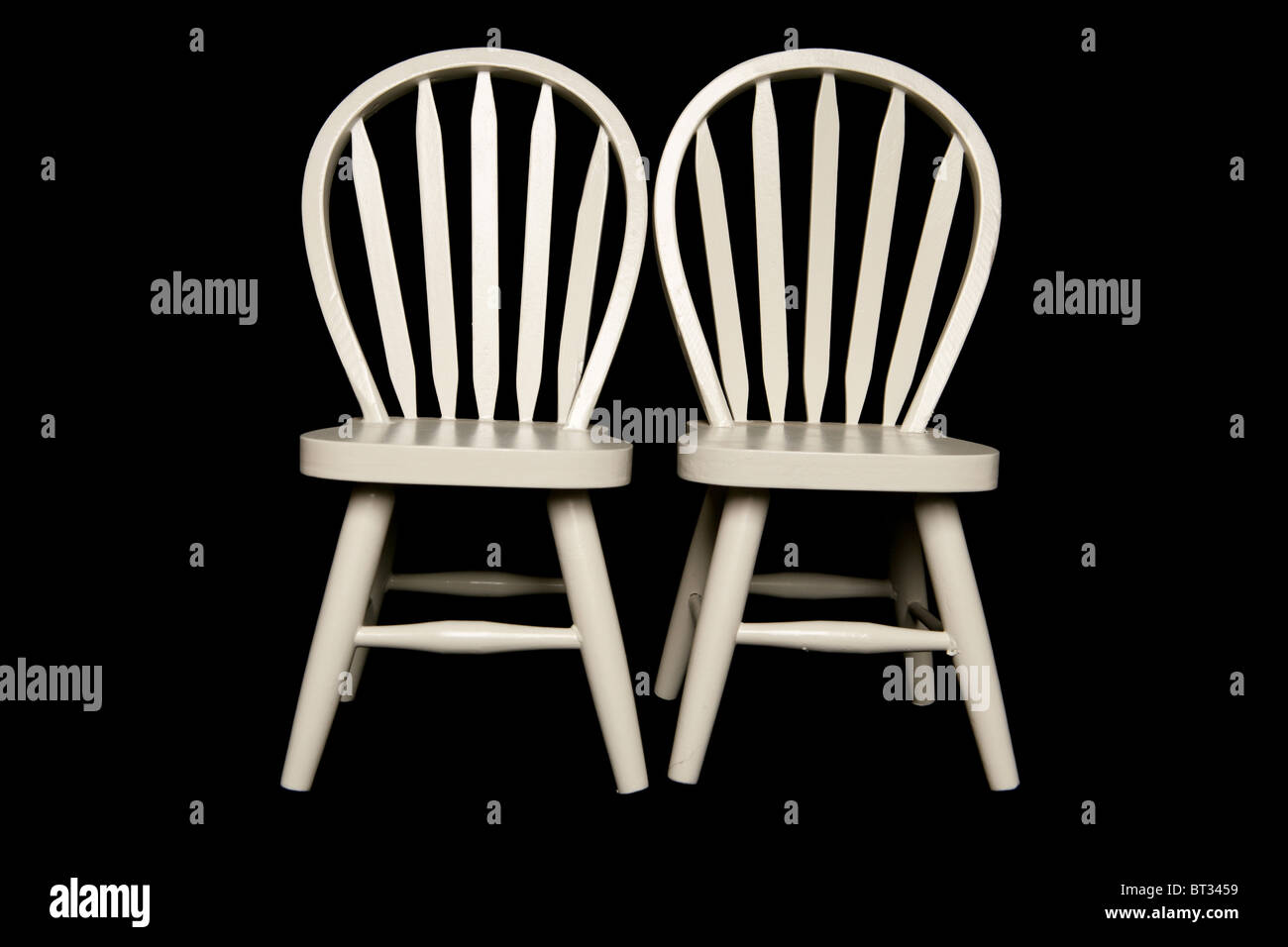 Two chairs isolated on black background Stock Photo - Alamy