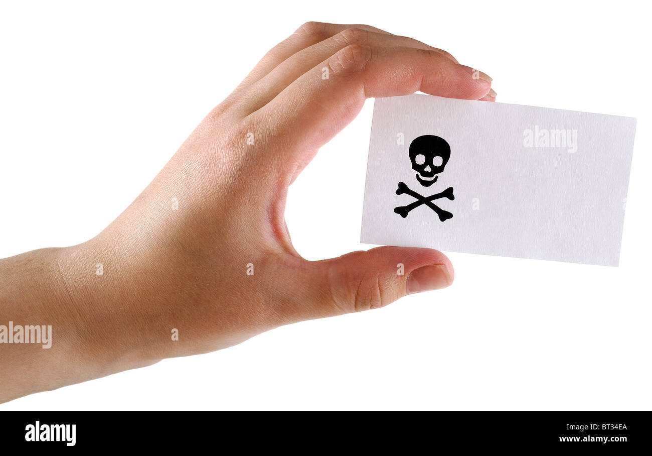 Paper card with the image black jolly Roger in a hand on a white ...