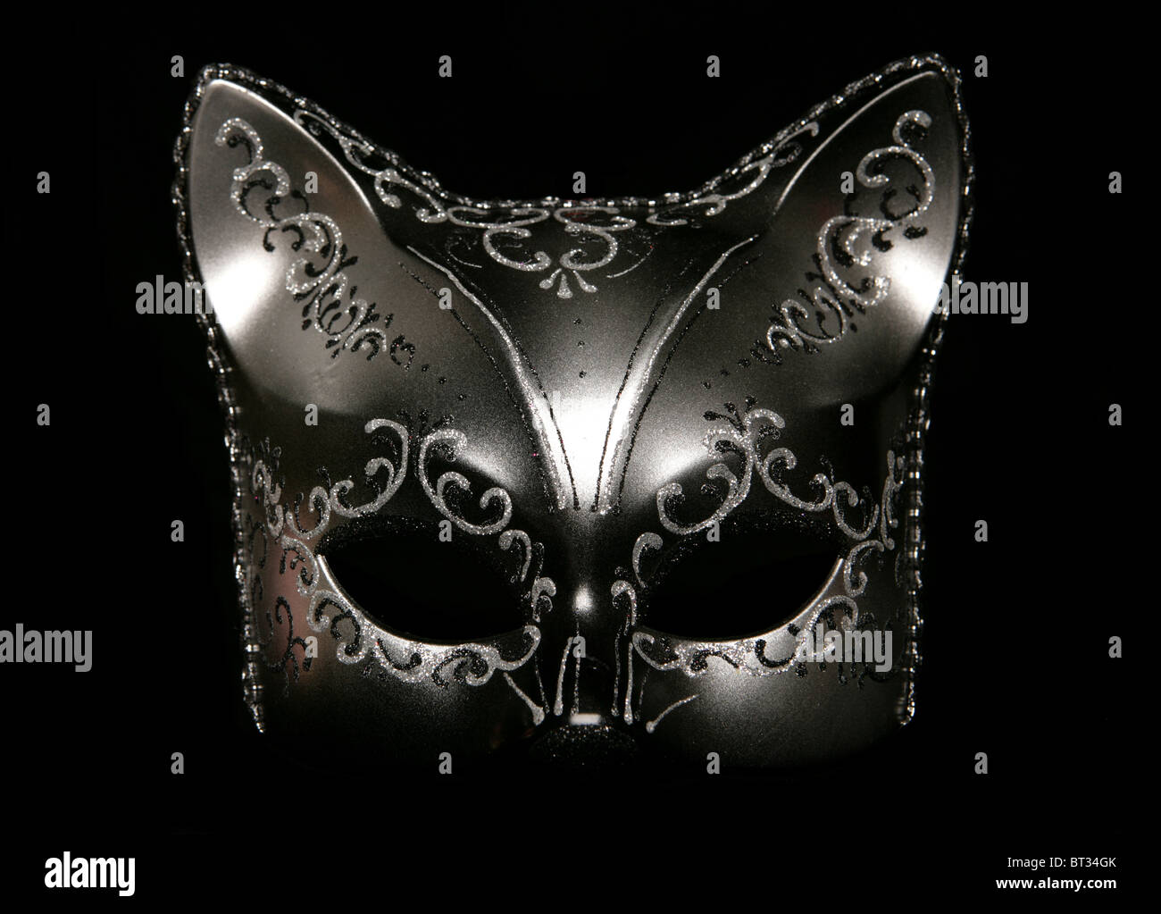 cat masquerade mask studio cutout on black background Stock Photo - Alamy