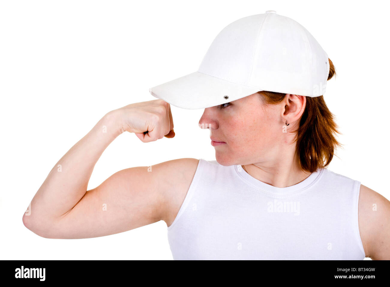 The strong girl in a cap on a white background Stock Photo - Alamy