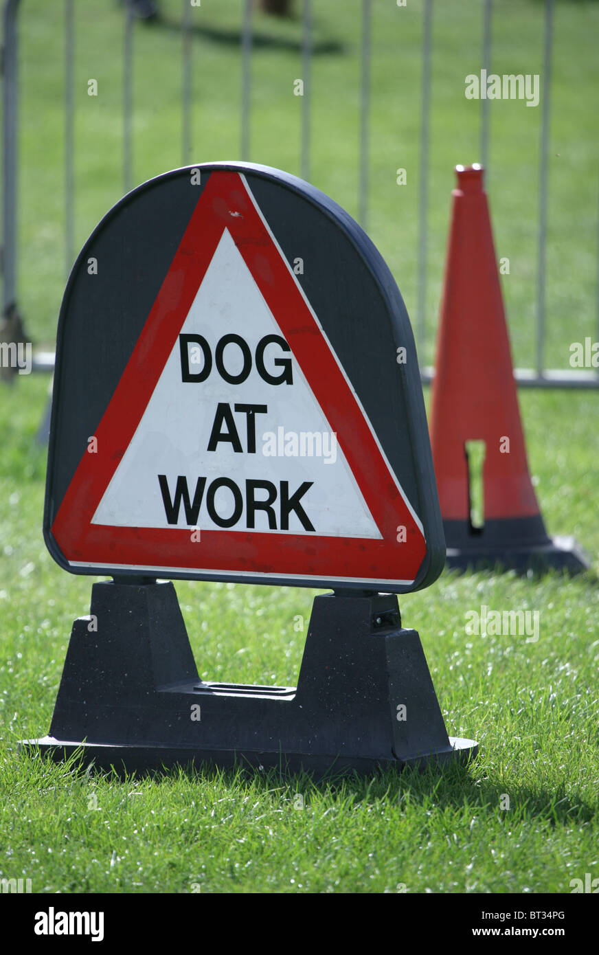 Dog at work sign UK Stock Photo - Alamy