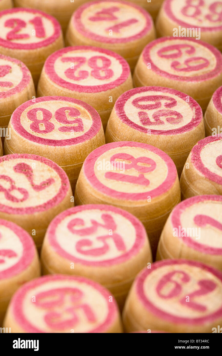 Wooden counters of bingo with red digits Stock Photo - Alamy