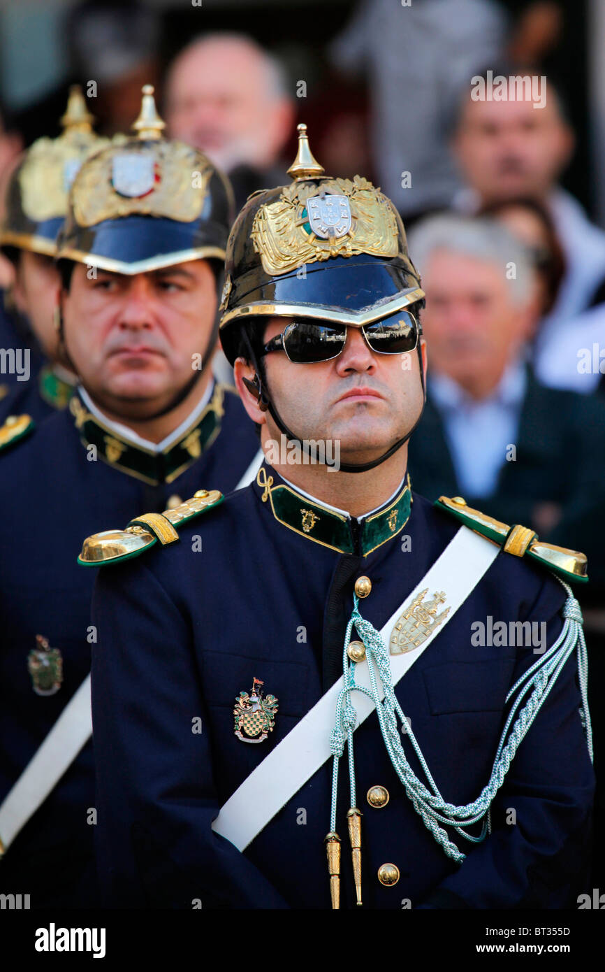 A member of Portugal's Republican Guard wears sunglasses on parade at ...