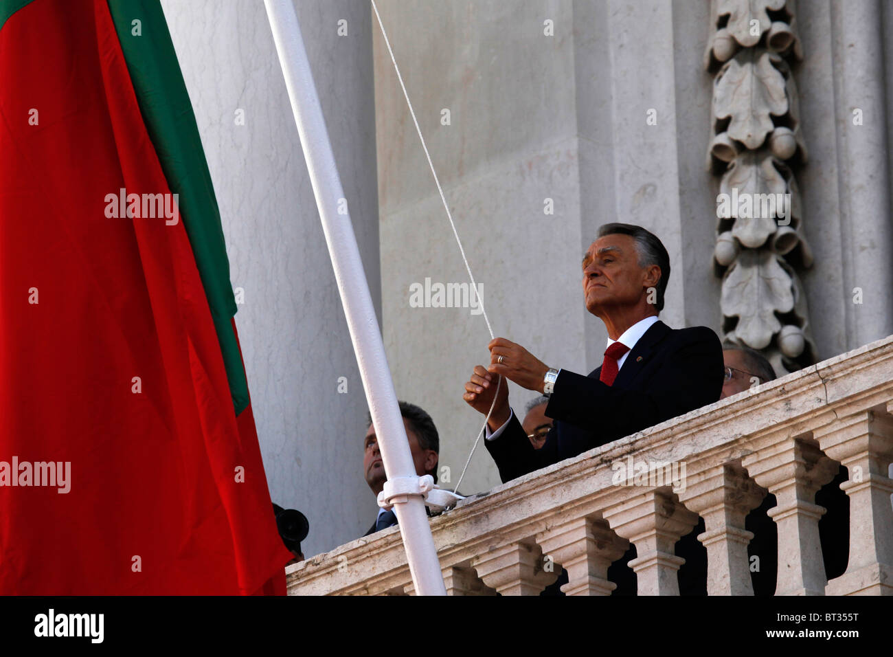 Cavaco Silva, the Portuguese President, raises the Portuguese national ...