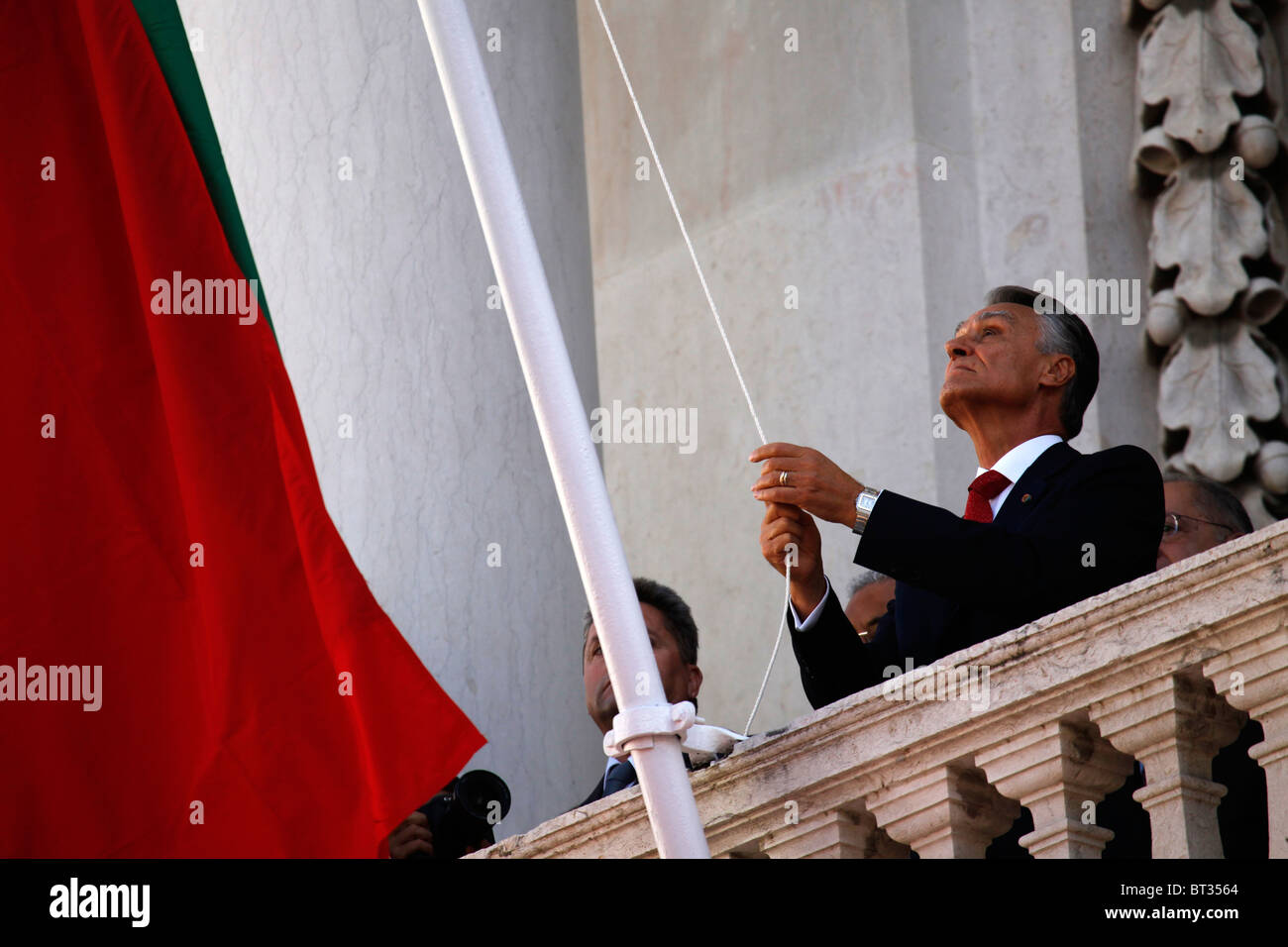 Cavaco Silva, the Portuguese President, raises the Portuguese national ...