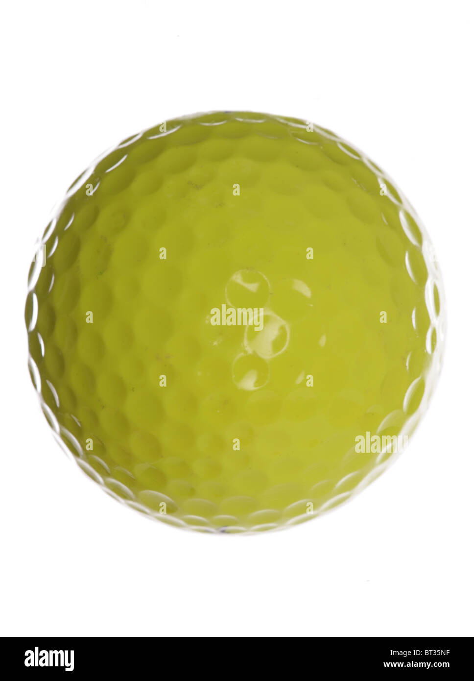 Yellow golf ball studio cutout Stock Photo - Alamy