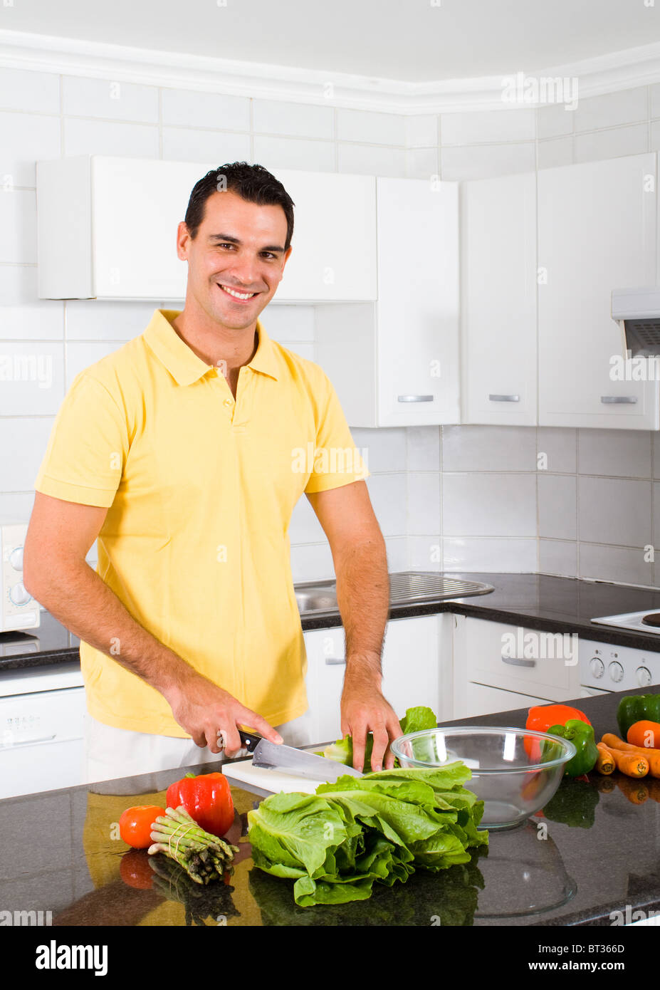 young man cooking in kitchen Stock Photo - Alamy