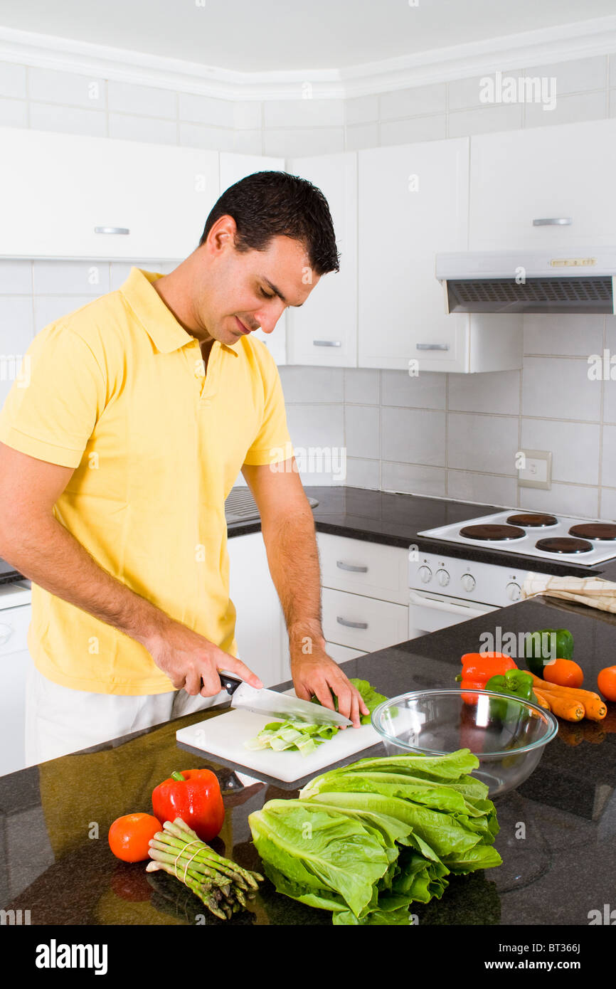 young man cooking in kitchen Stock Photo - Alamy