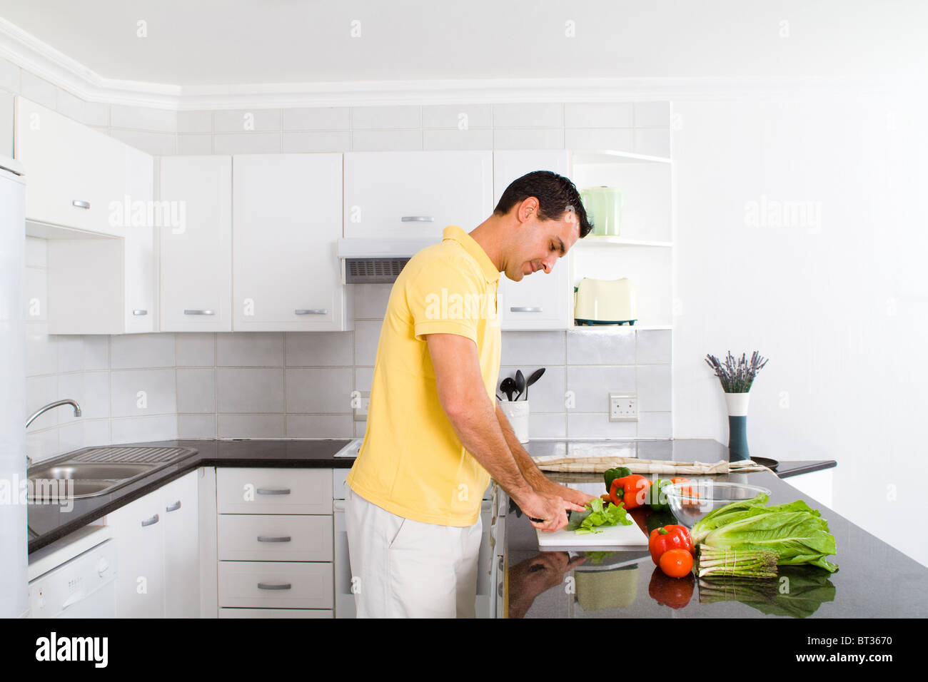 young man cooking in kitchen Stock Photo - Alamy