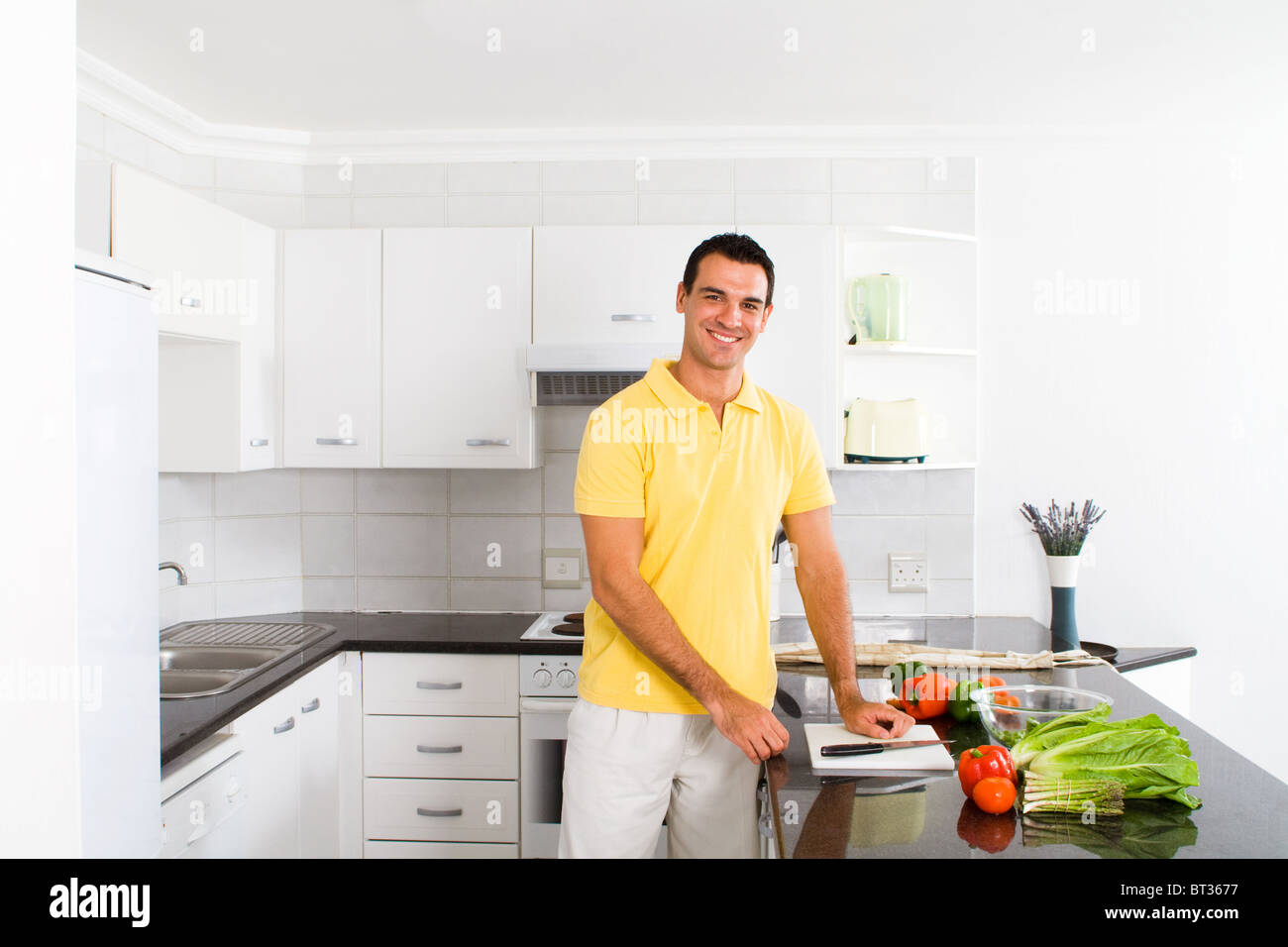 young man cooking in kitchen Stock Photo - Alamy