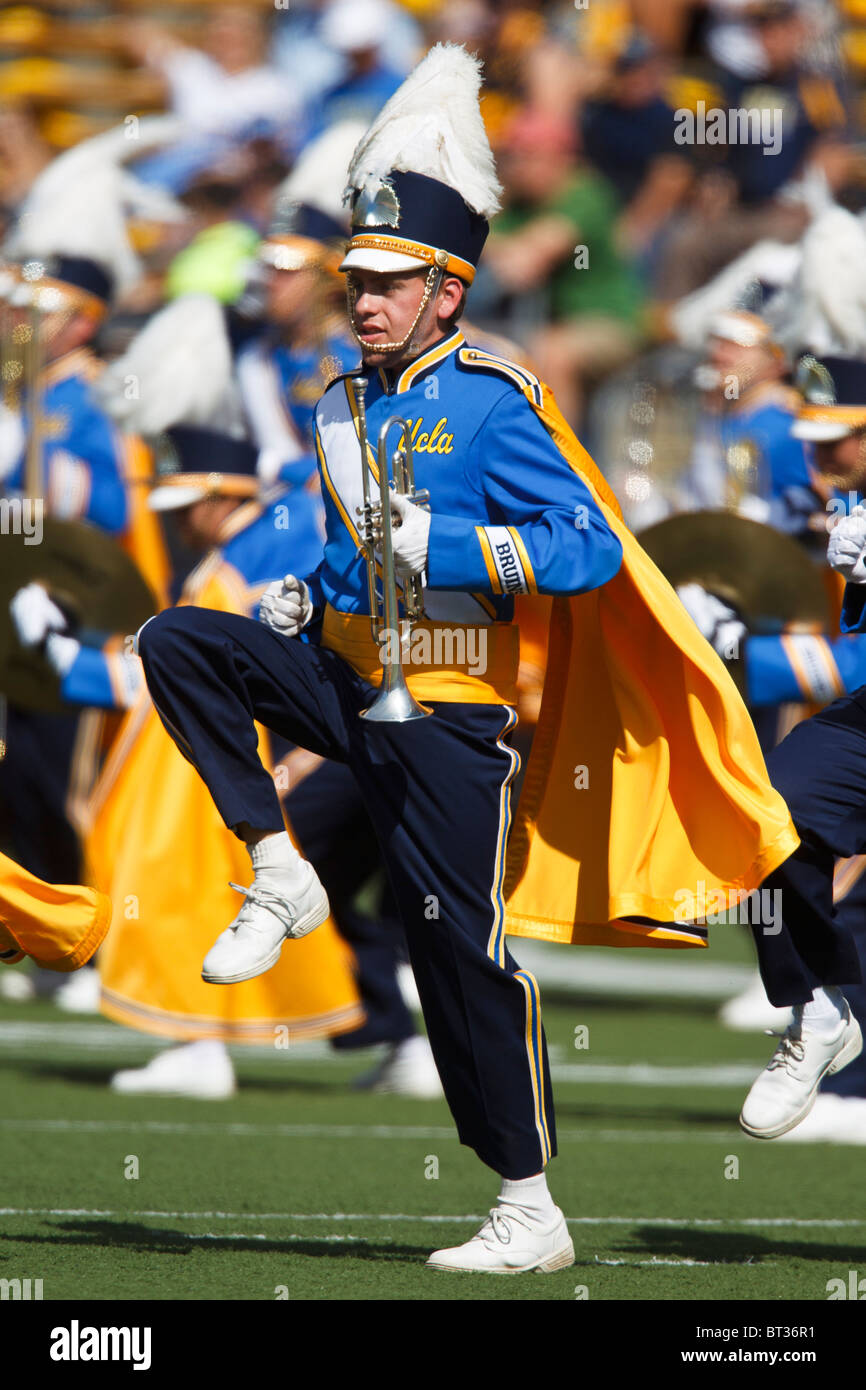 Member of the UCLA Bruins marching band performs before a football game ...