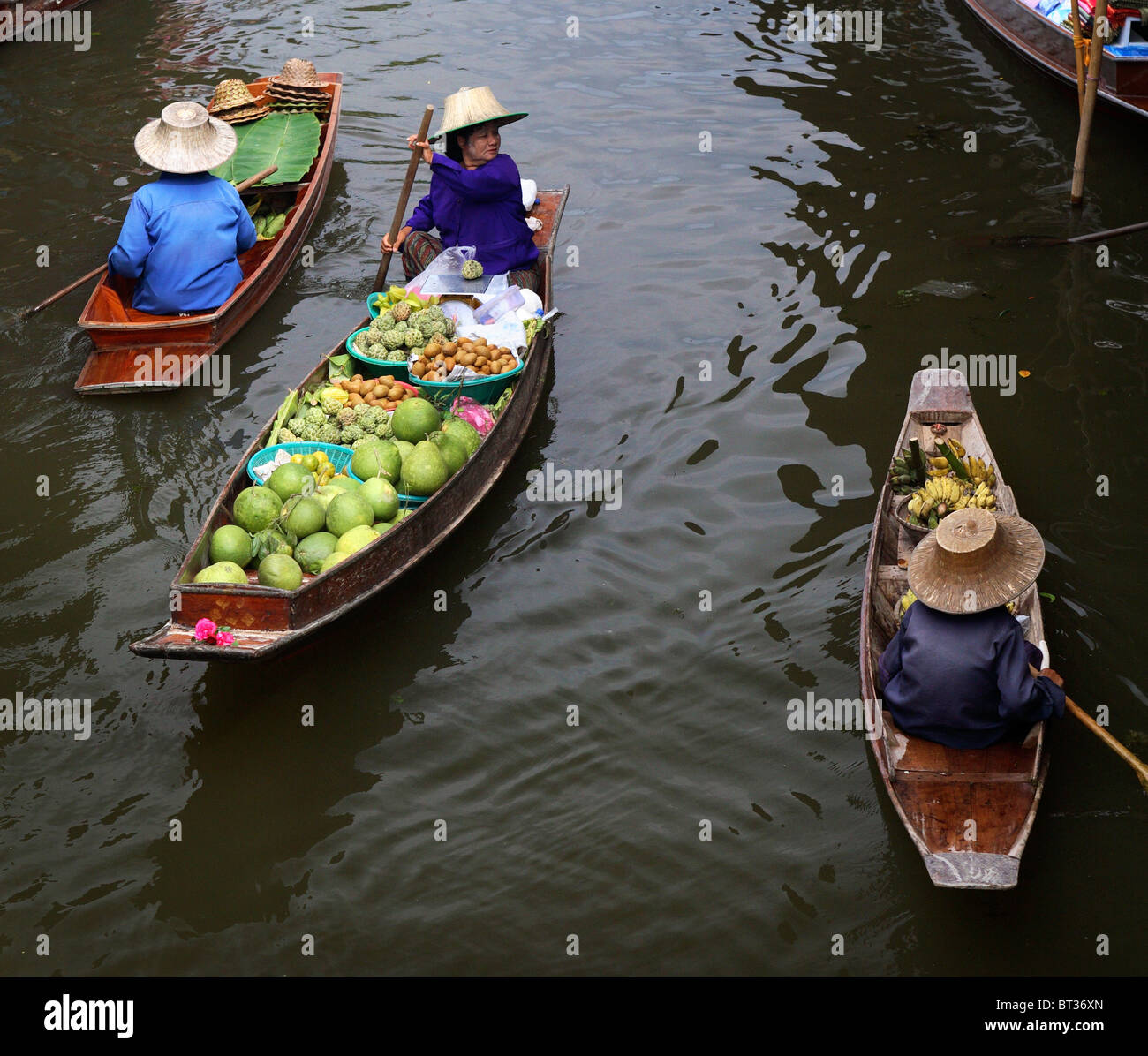 Merchants at floating market in Bangkok, Thailand Stock Photo - Alamy