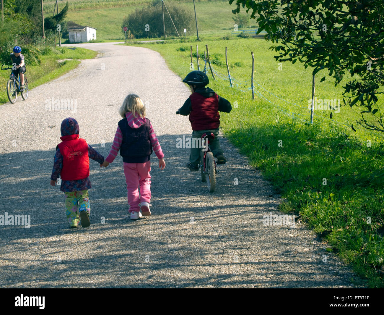 Group of children in street play Stock Photo - Alamy