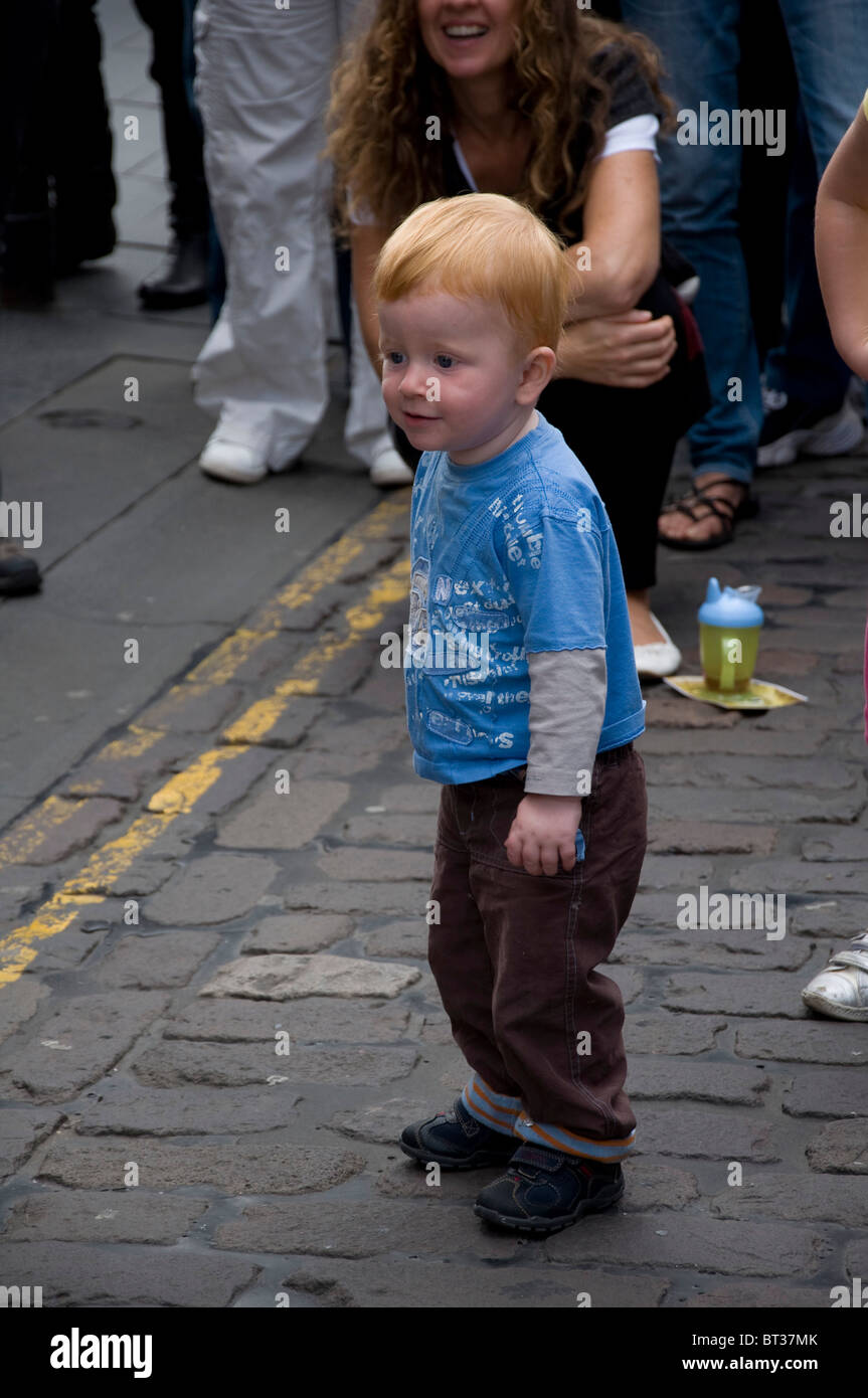 Young boy dancing to an Australian jug band busking at the Edinburgh ...