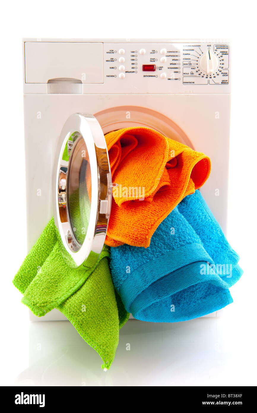 Laundromat with colorful laundry isolated over white Stock Photo - Alamy