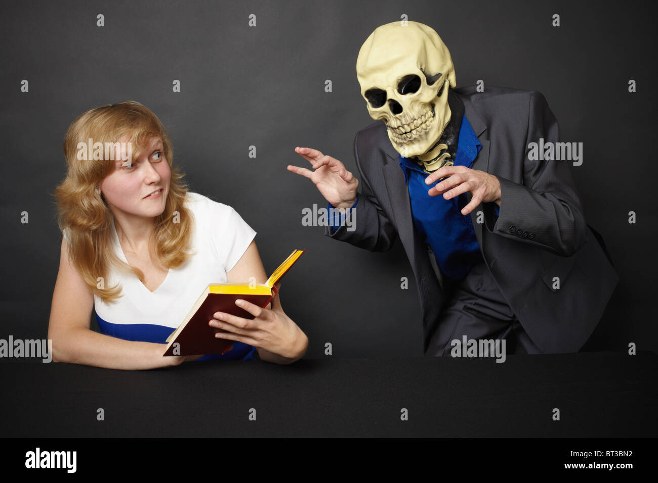 A young woman experiences hallucinations - funny skeleton Stock Photo ...