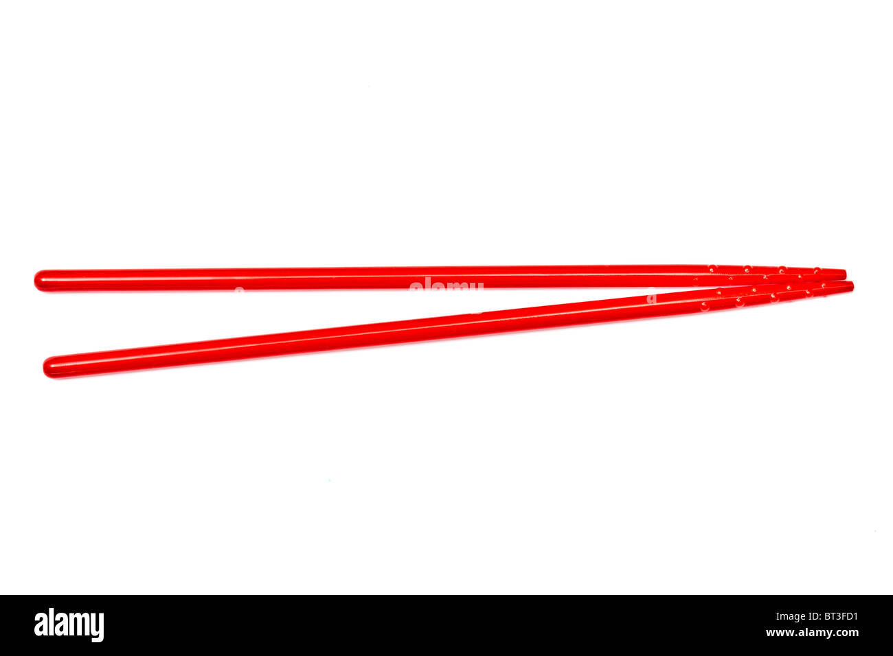 Red chopsticks isolated on white background Stock Photo - Alamy