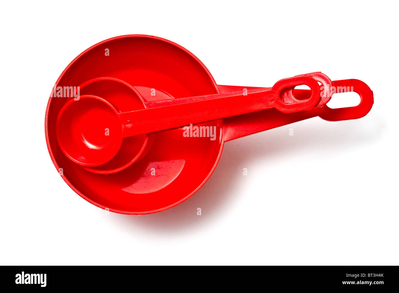Set of red plastic measuring cups isolated on white background Stock ...