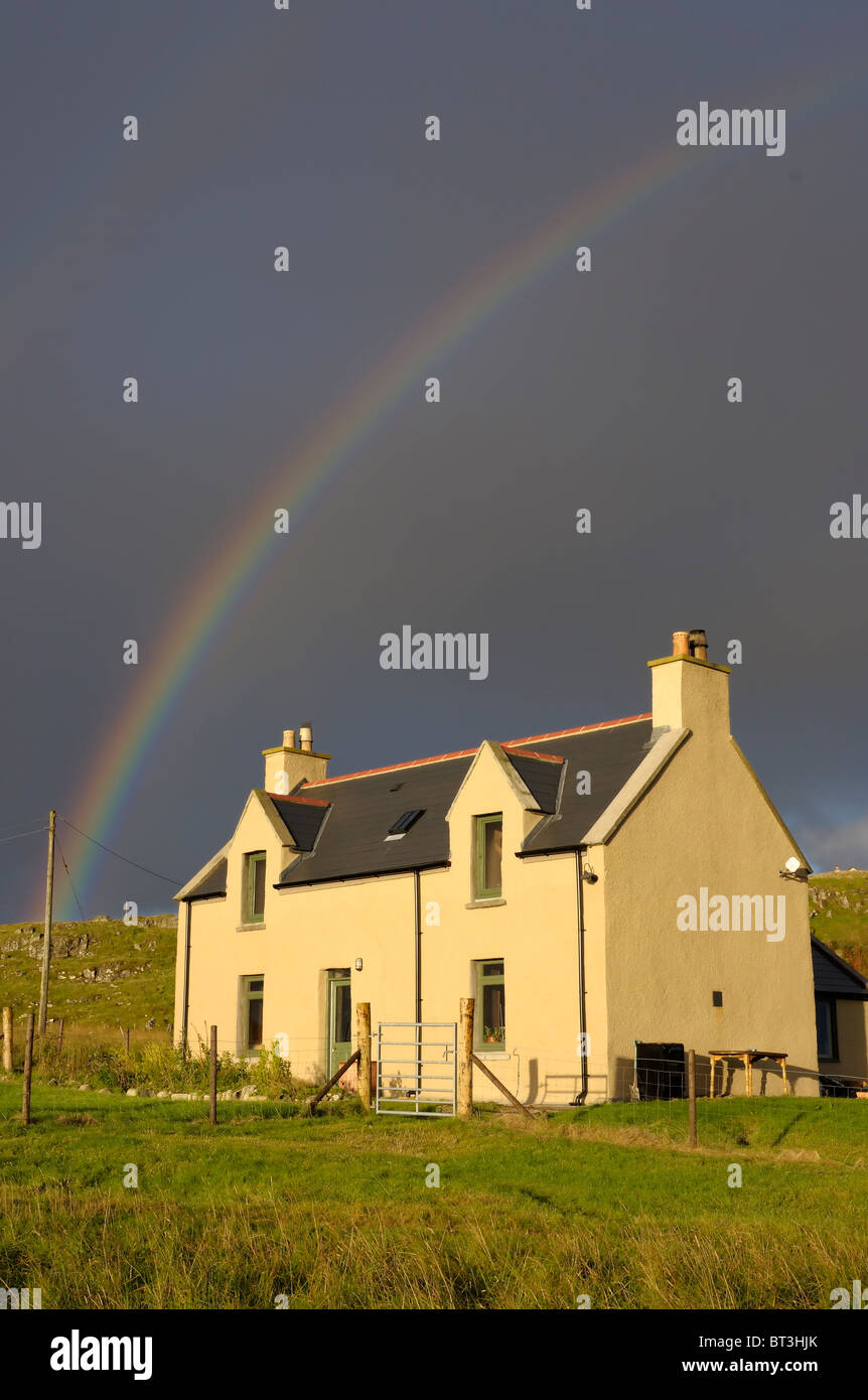 Rainbow over a croft house Stock Photo - Alamy
