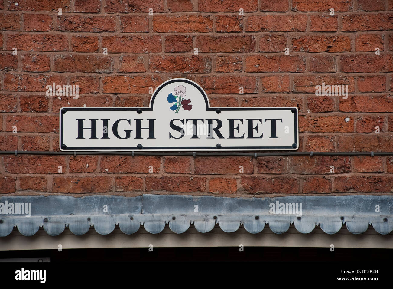Street sign fixed to a brick wall in an English town Stock Photo - Alamy