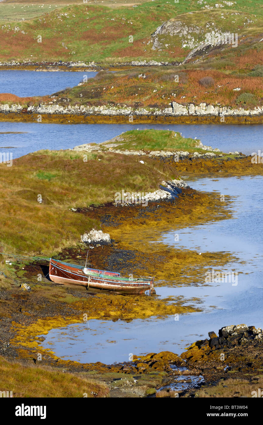 Old boat on rocky beach on Loch Erisort between Caras and Cromore Stock ...