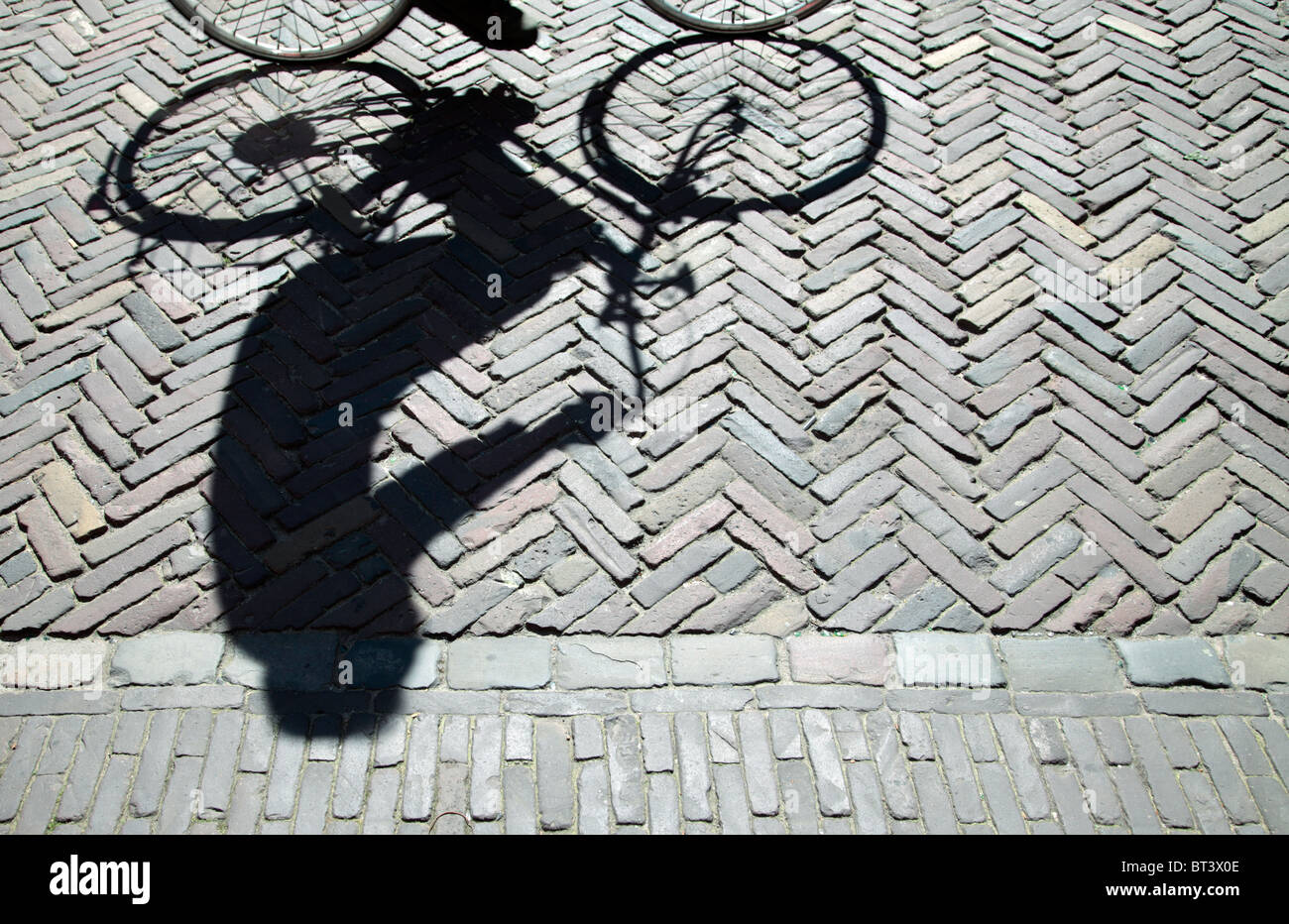 Bicycle shadow hi-res stock photography and images - Alamy