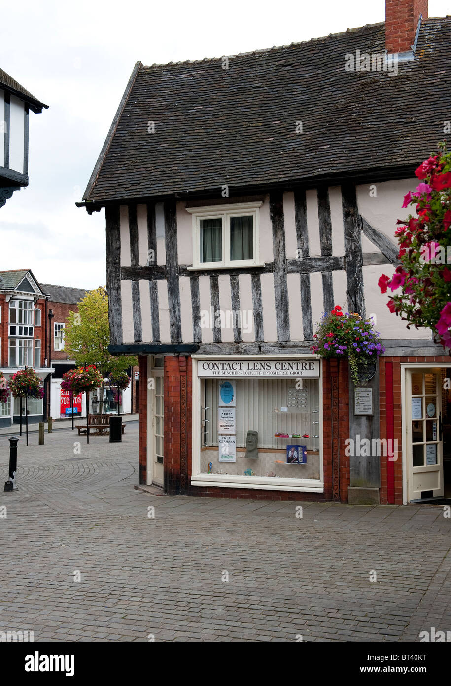 Old half timbered building now housing a modern shop in the small ...