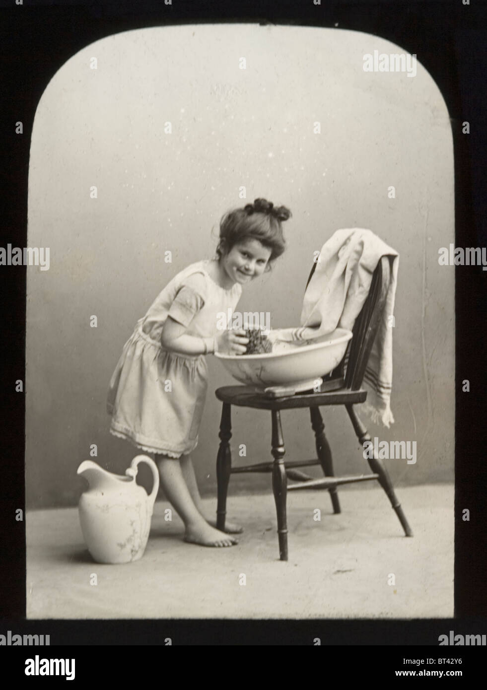 Victorian magic lantern slide. Morning ablutions. Child taking her ...