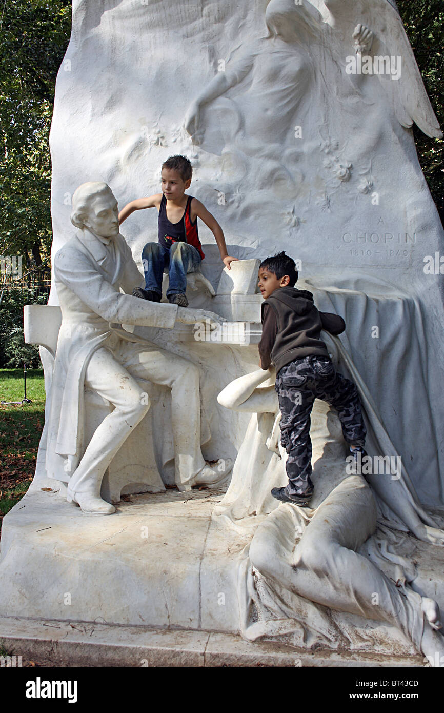 Children climbing on Statue to Chopin in the Parc Monceau, Paris Stock ...