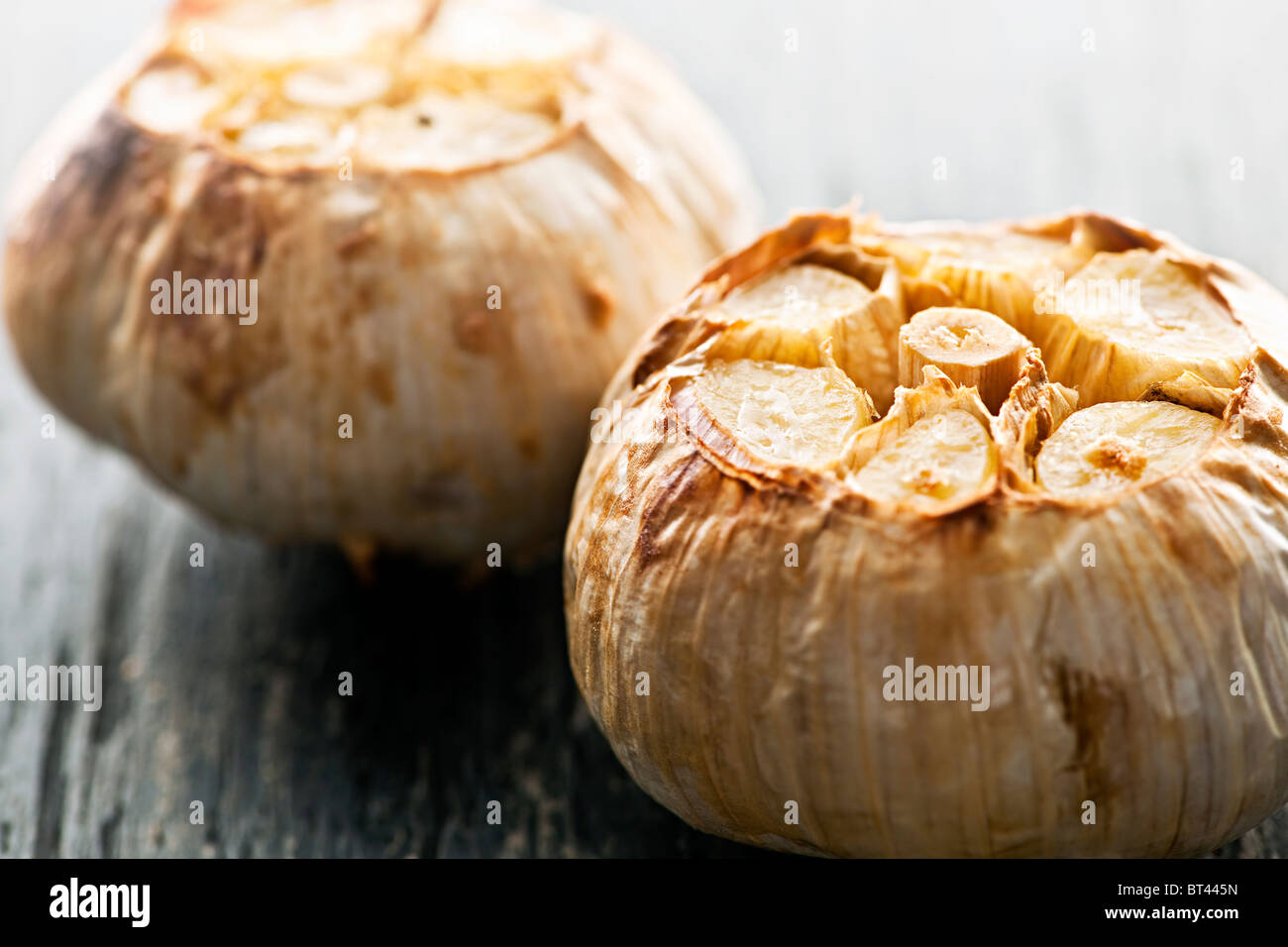 Close up of fresh roasted garlic bulbs Stock Photo - Alamy