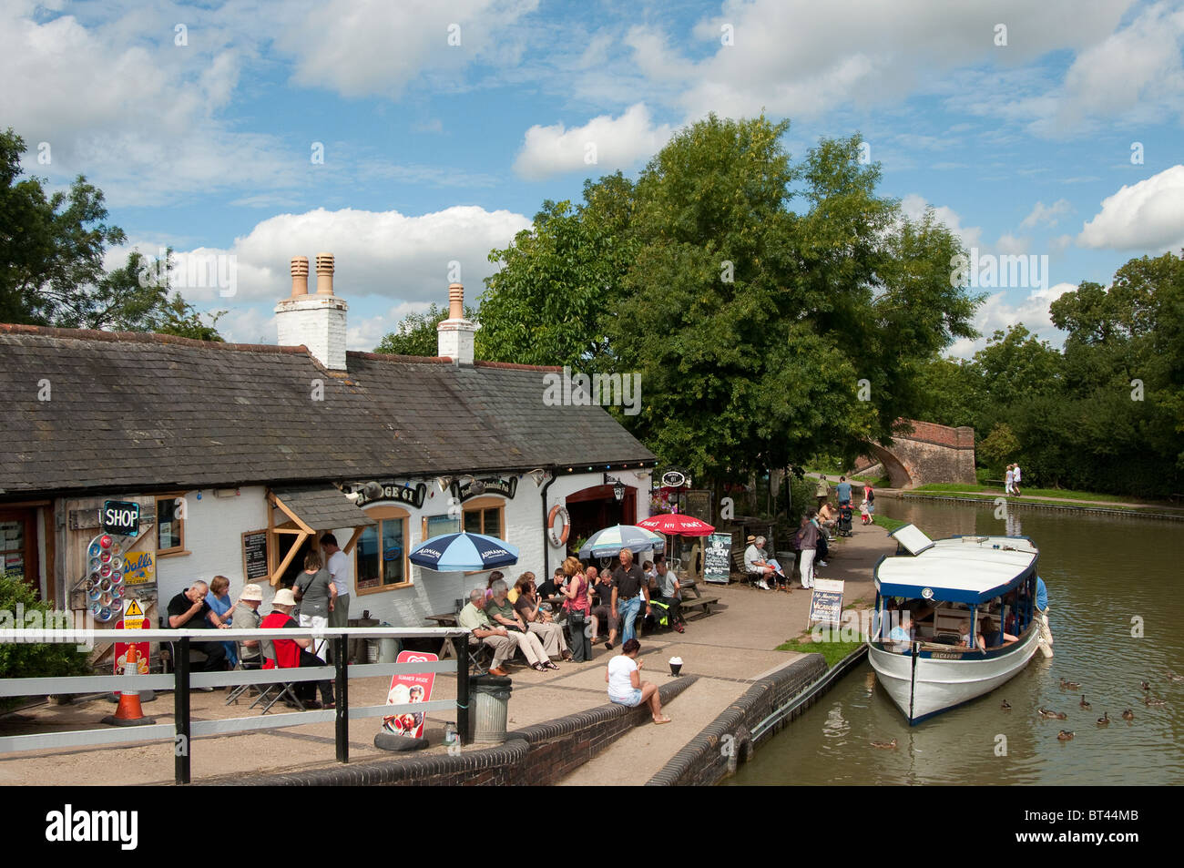 People enjoying refreshments outside a tea shop at Foxton Locks on the ...