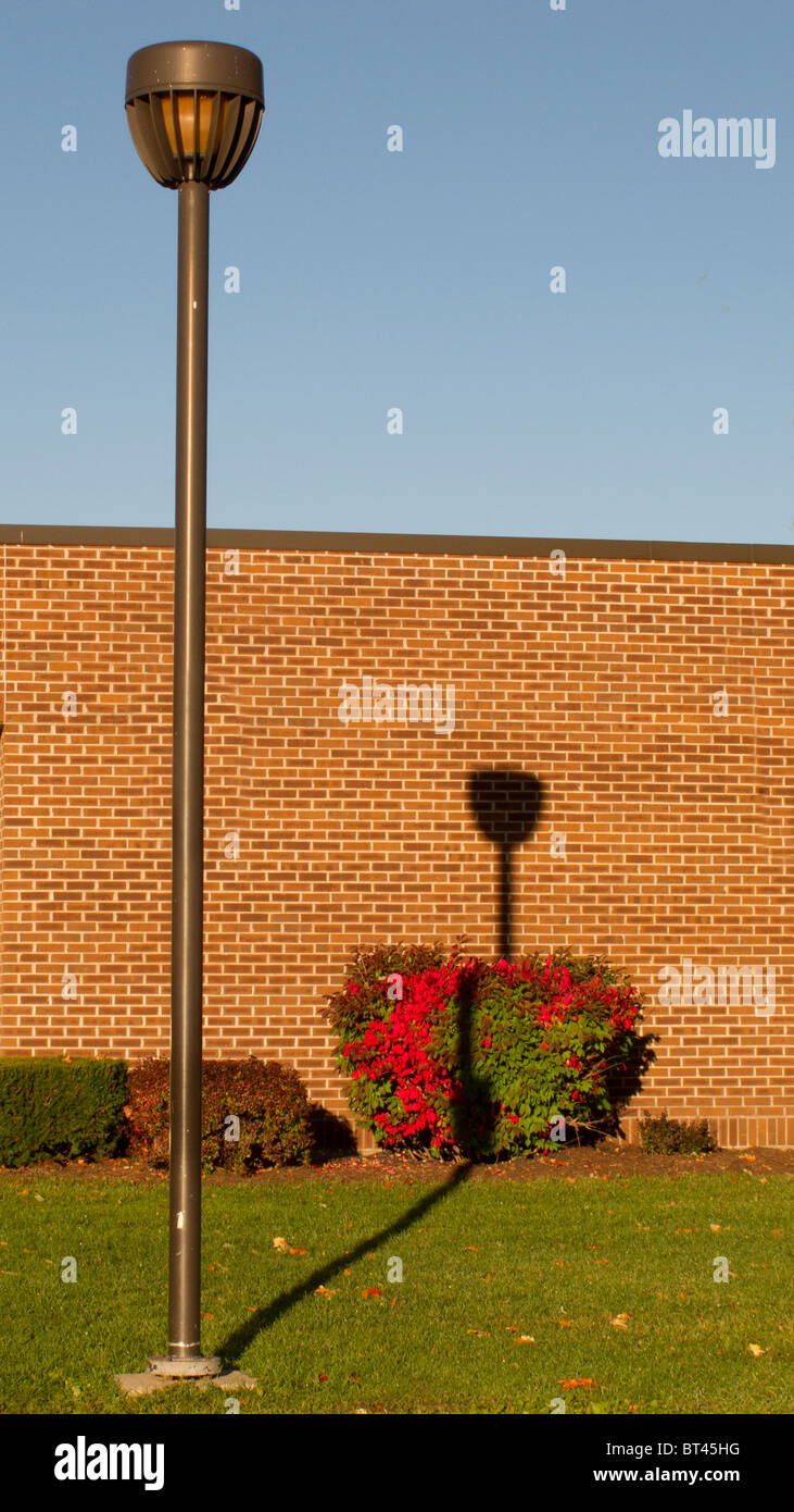 Lamppost casting shadow Stock Photo - Alamy
