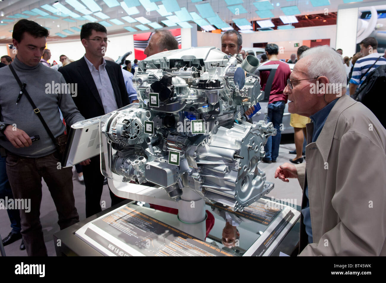 Visitors viewing Renault engine at Paris Motor Show 2010 Stock Photo ...