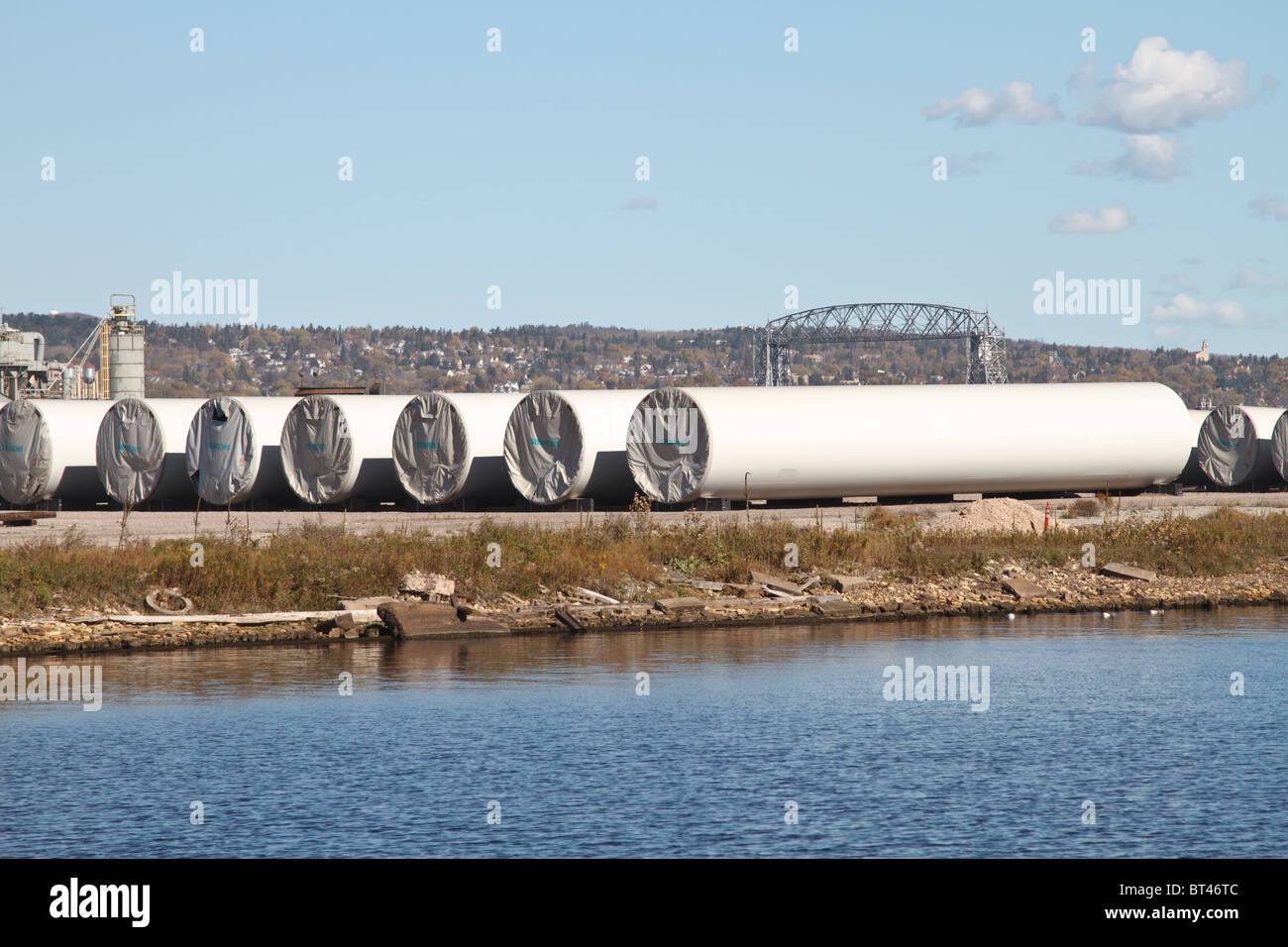 Bases for giant wind turbine await lie in wait at a port terminal in ...