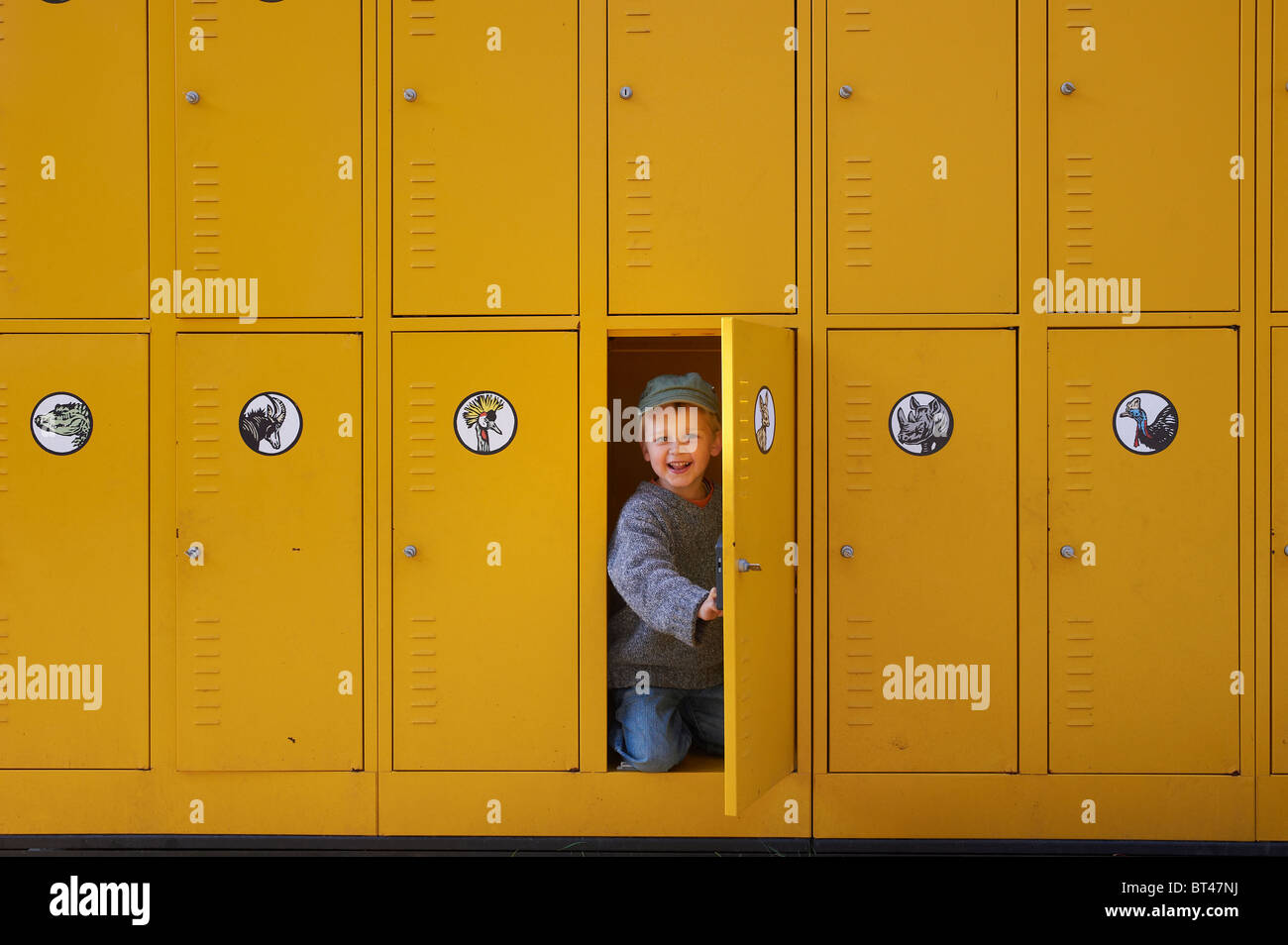 Child boy playing in Safety deposit boxes Stock Photo - Alamy