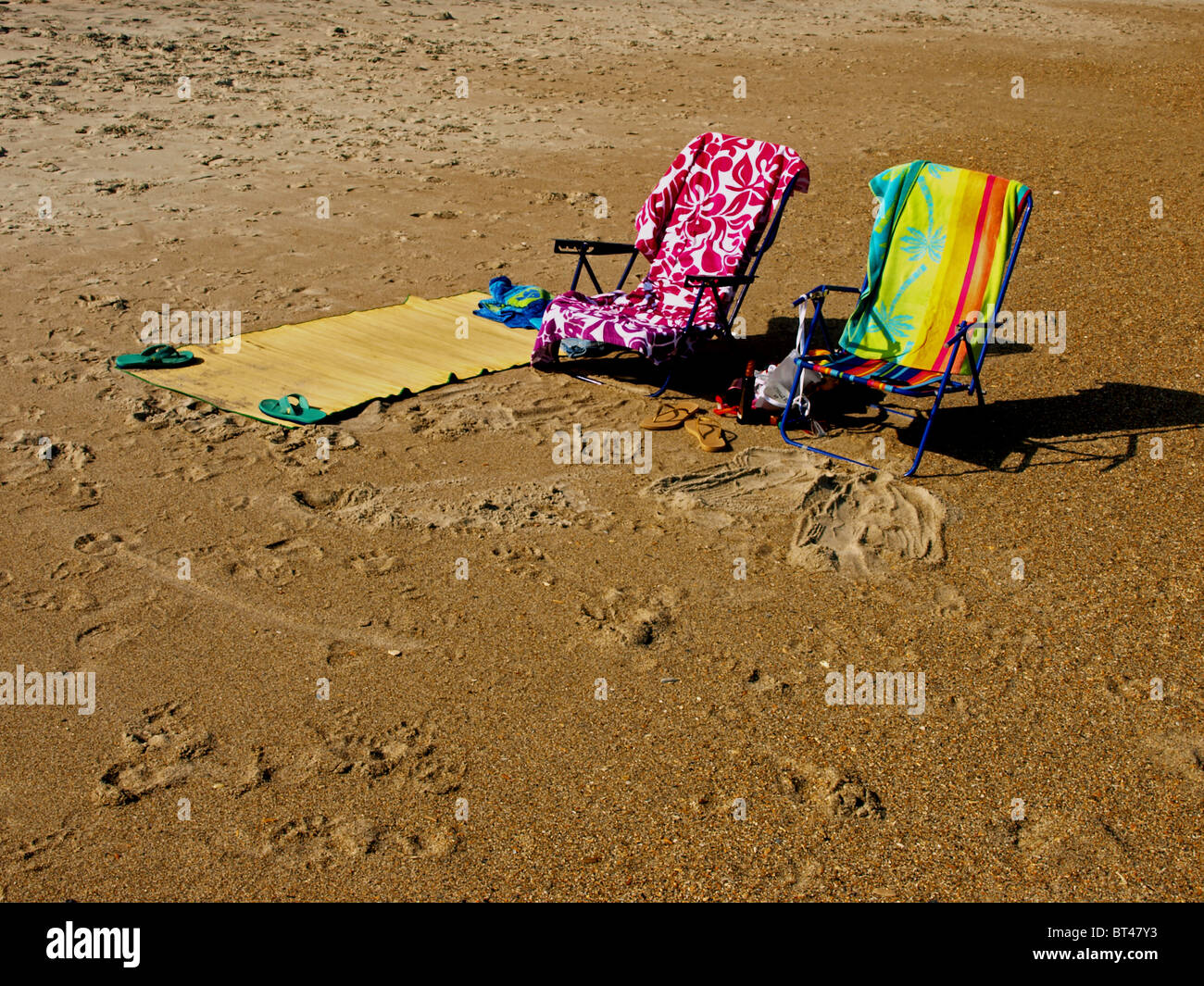 beach ocean sand chair water plastic colorful Stock Photo - Alamy