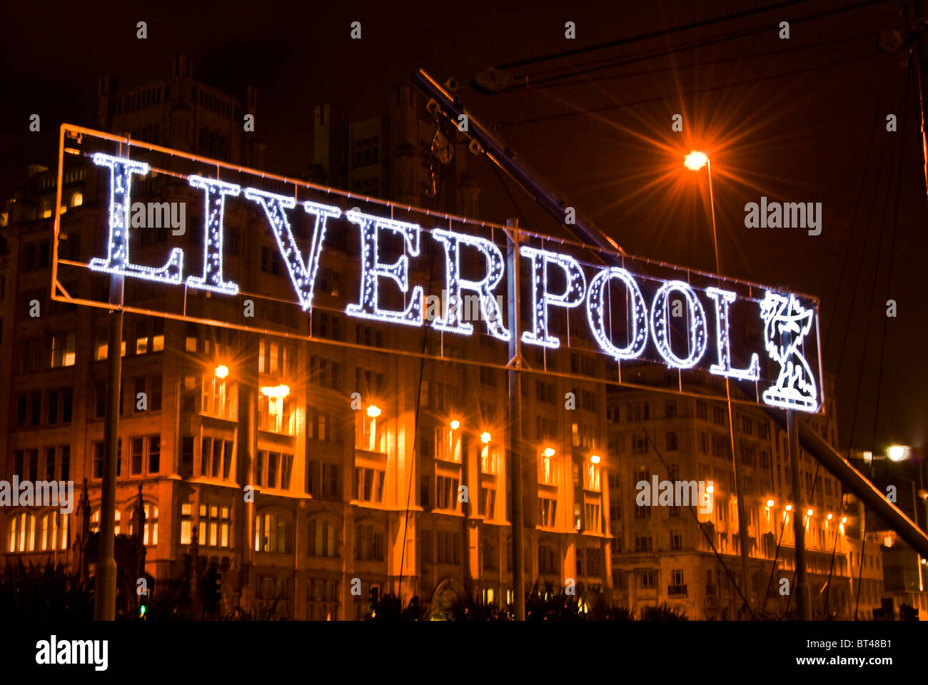 The word 'Liverpool' lit up at night used as a display sign, England ...