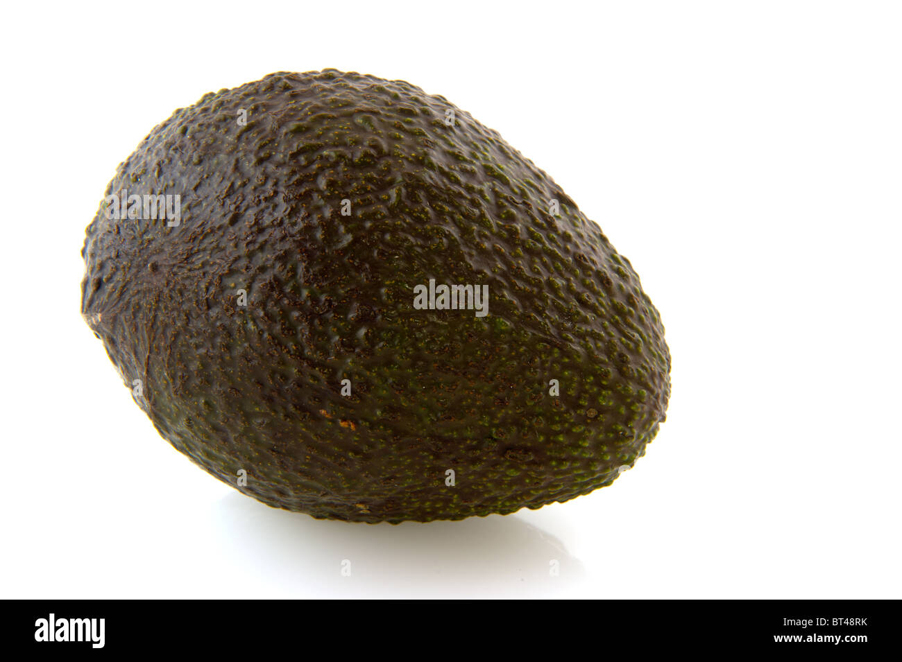 Fresh whole avocado isolated over white background Stock Photo - Alamy
