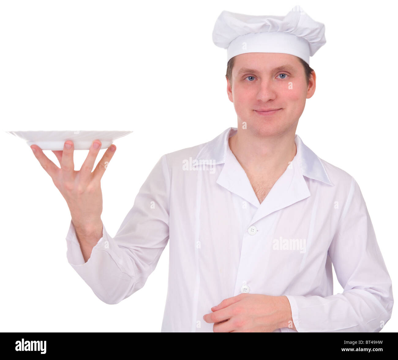 Cook in white overall with the plate a white background Stock Photo - Alamy