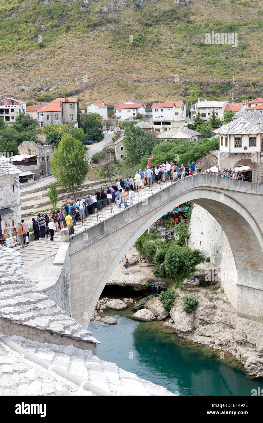Each day a local man from the Mostar diving club gathers a crowd and ...