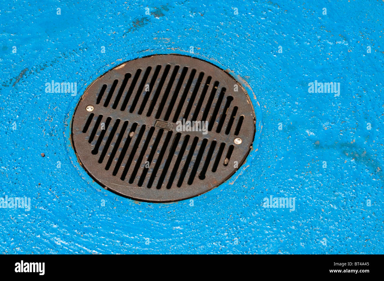 Metal water drain in concrete floor Stock Photo - Alamy