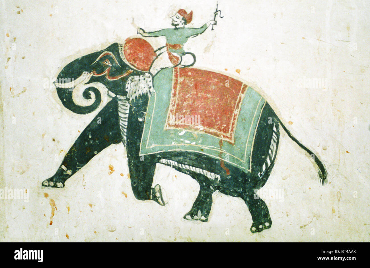 Indian wall painting of a man riding elephant in udaipur rajasthan ...