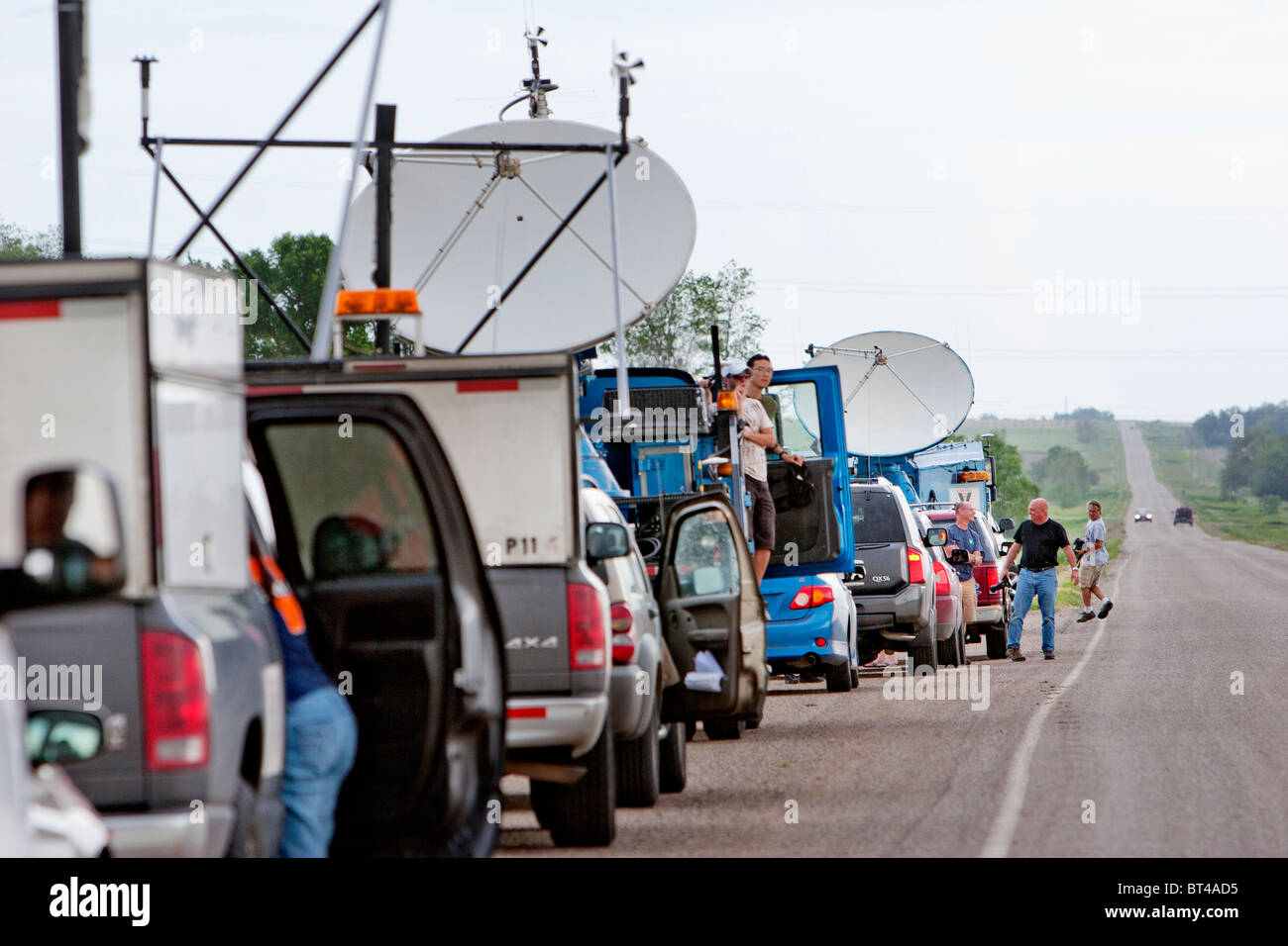 Storm chasers with Project Vortex 2 line up along a road in South ...