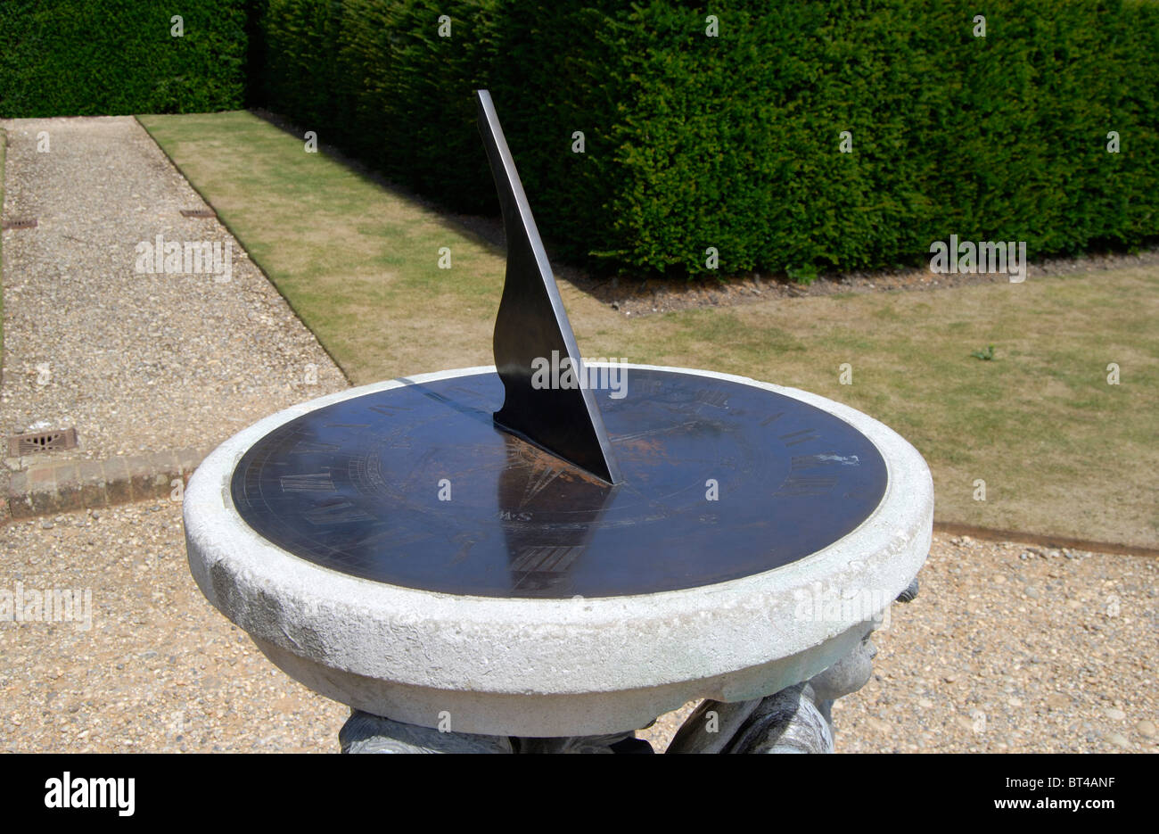 Sundial at midday in an English country garden. Surrey. England Stock ...