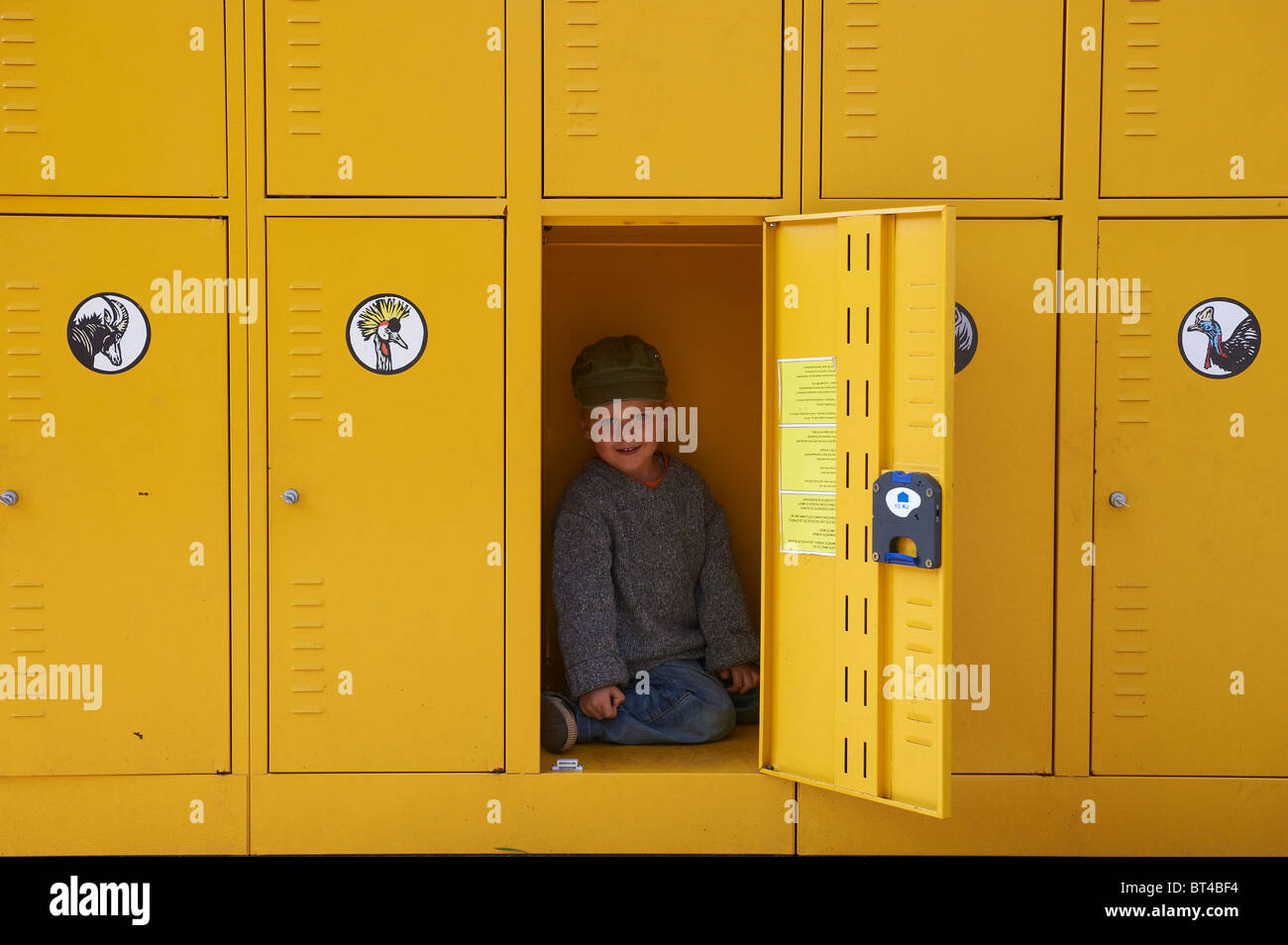 Child boy playing in Safety deposit boxes Stock Photo - Alamy