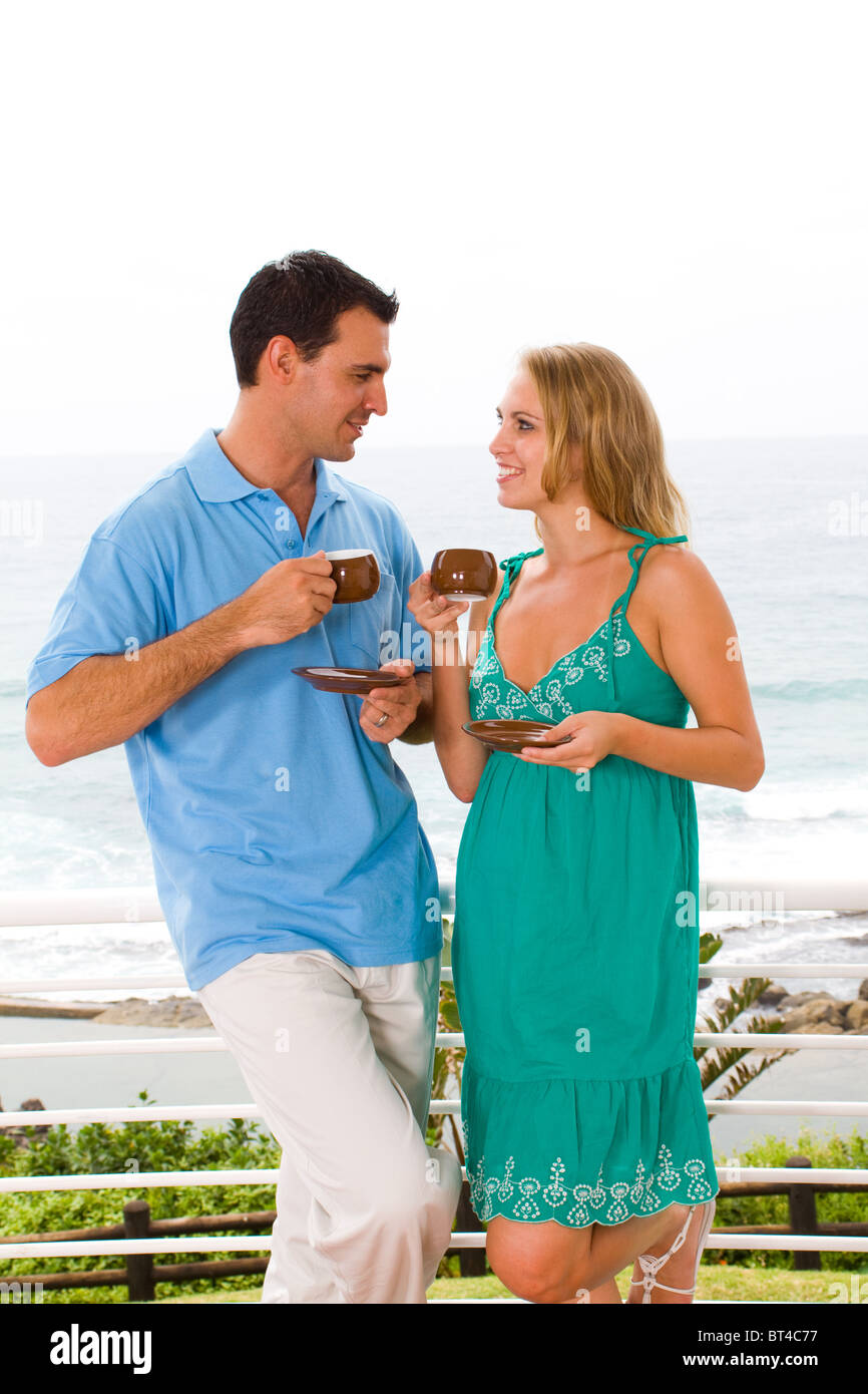 Two people on balcony behind hi-res stock photography and images - Alamy