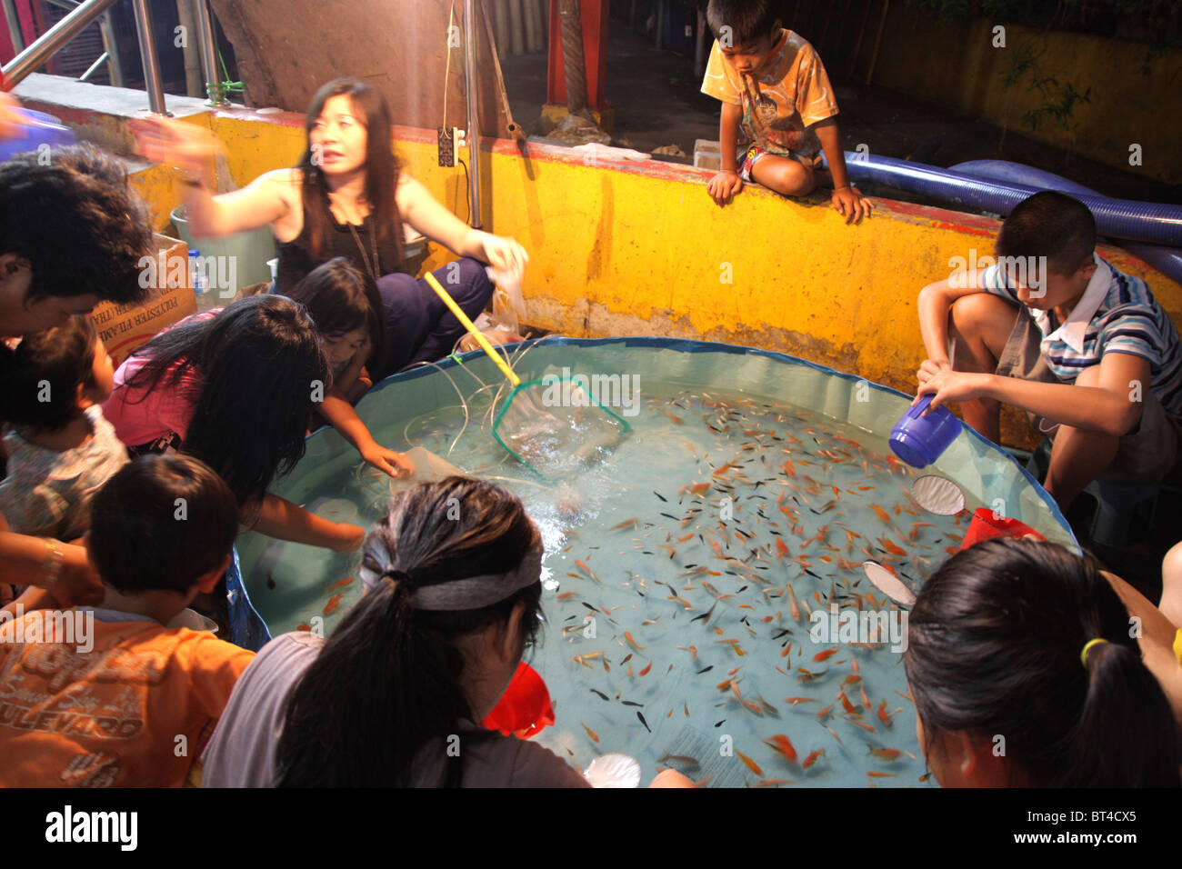 People playing fishing game , Bangkok Stock Photo - Alamy
