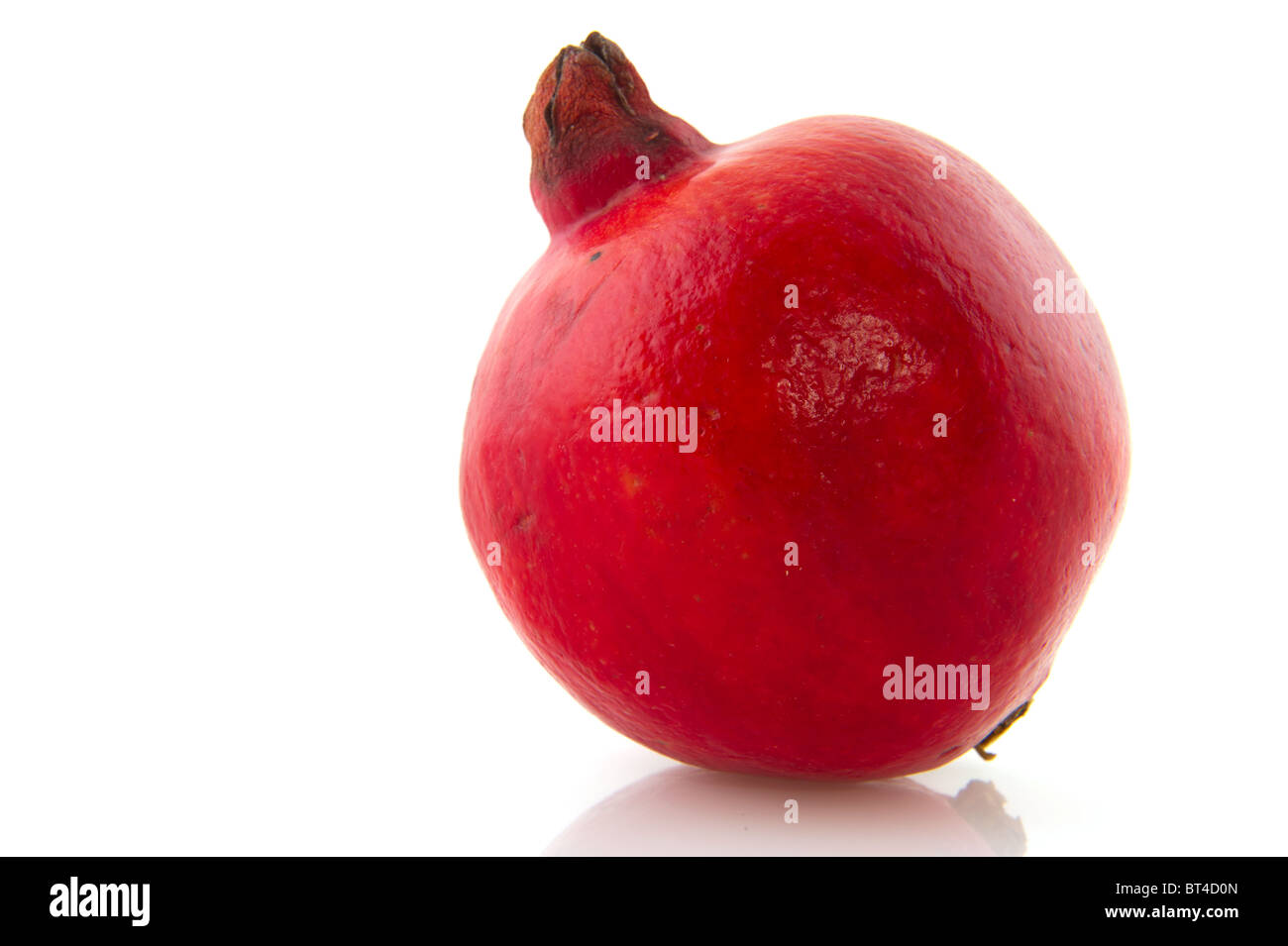 Fresh whole pomegranate isolated over white background Stock Photo - Alamy